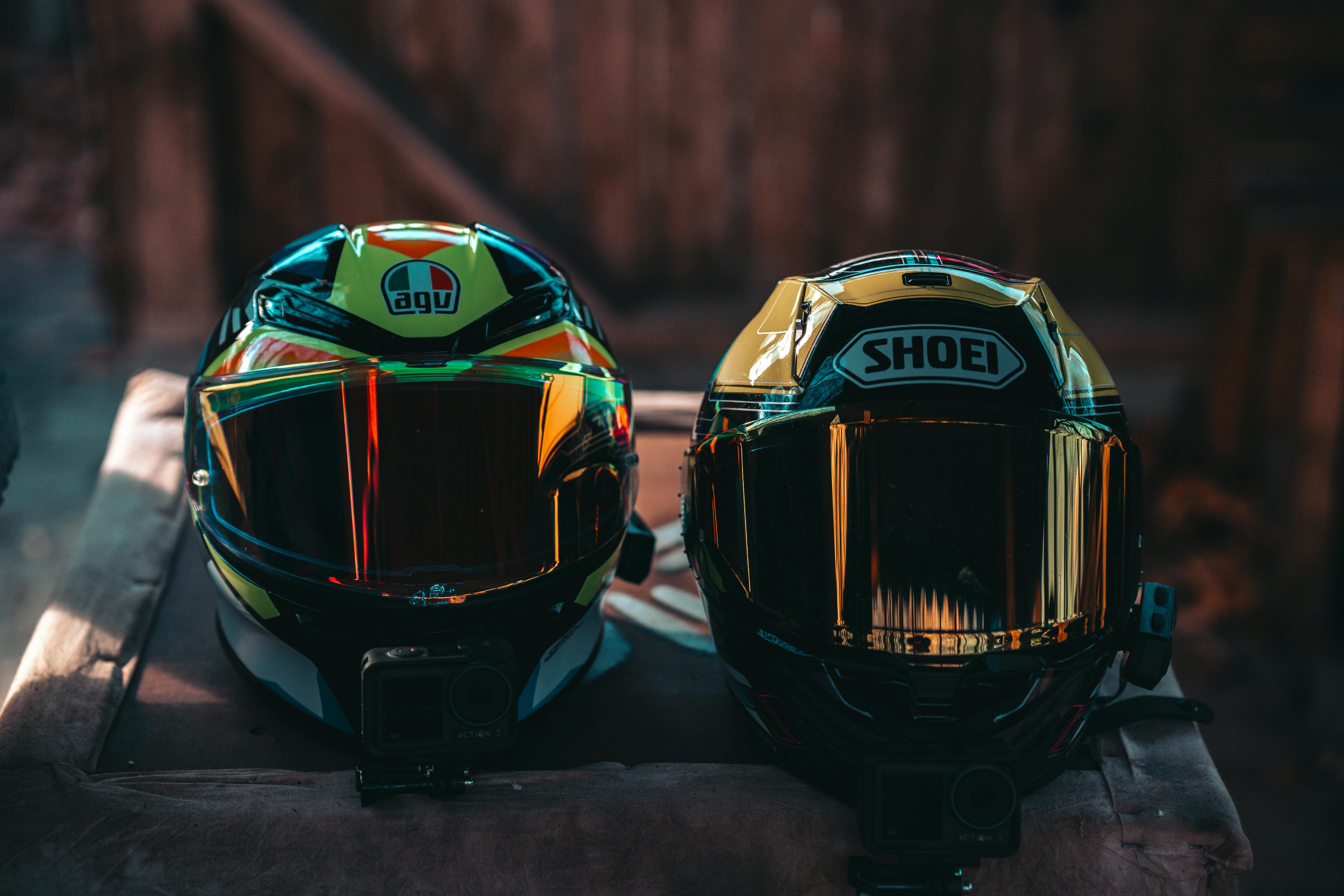 Colorful motorcycle helmets with reflective visors · Free Stock Photo