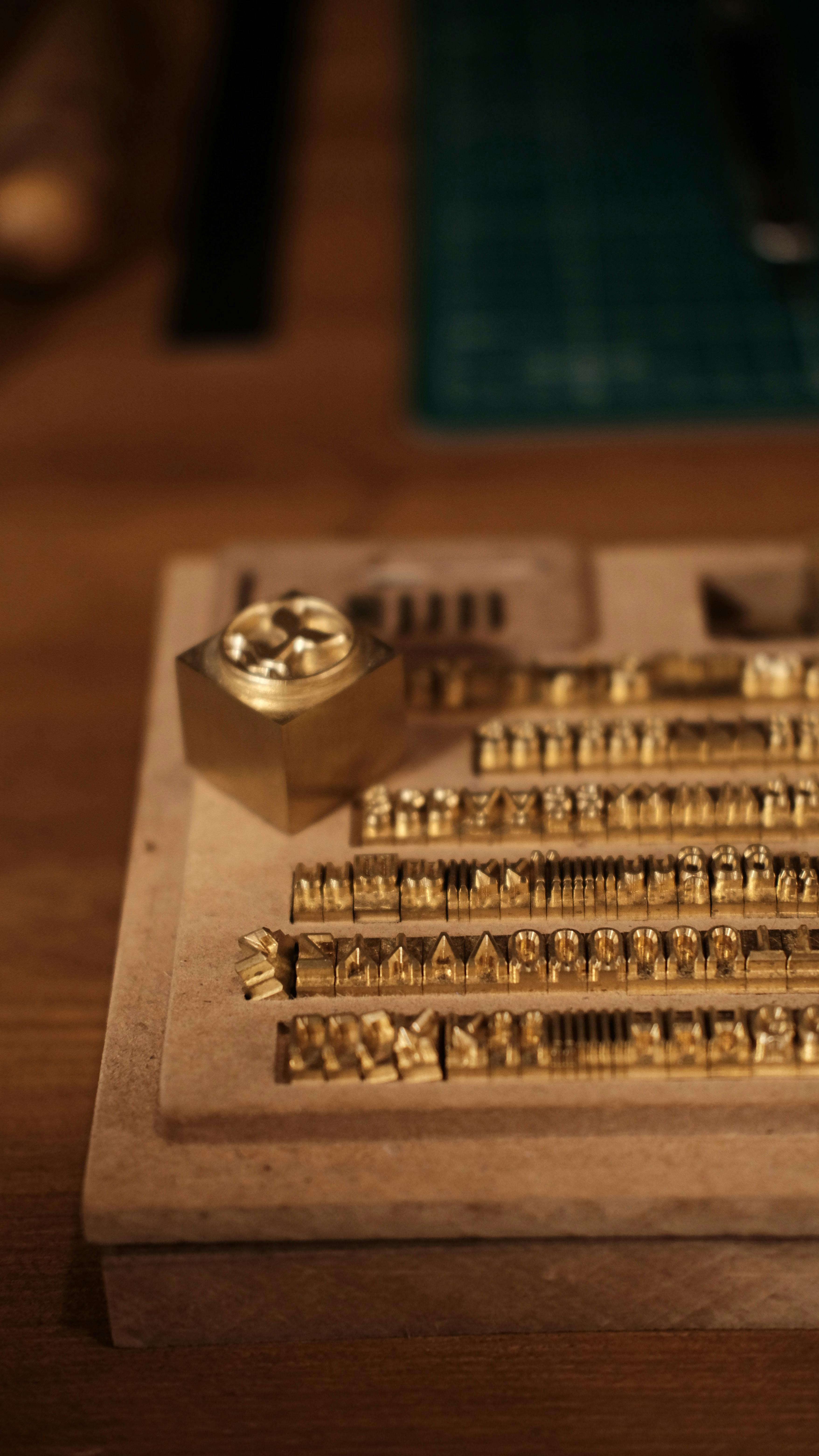 Handcrafted Metal Casting Tools on a Workbench · Free Stock Photo