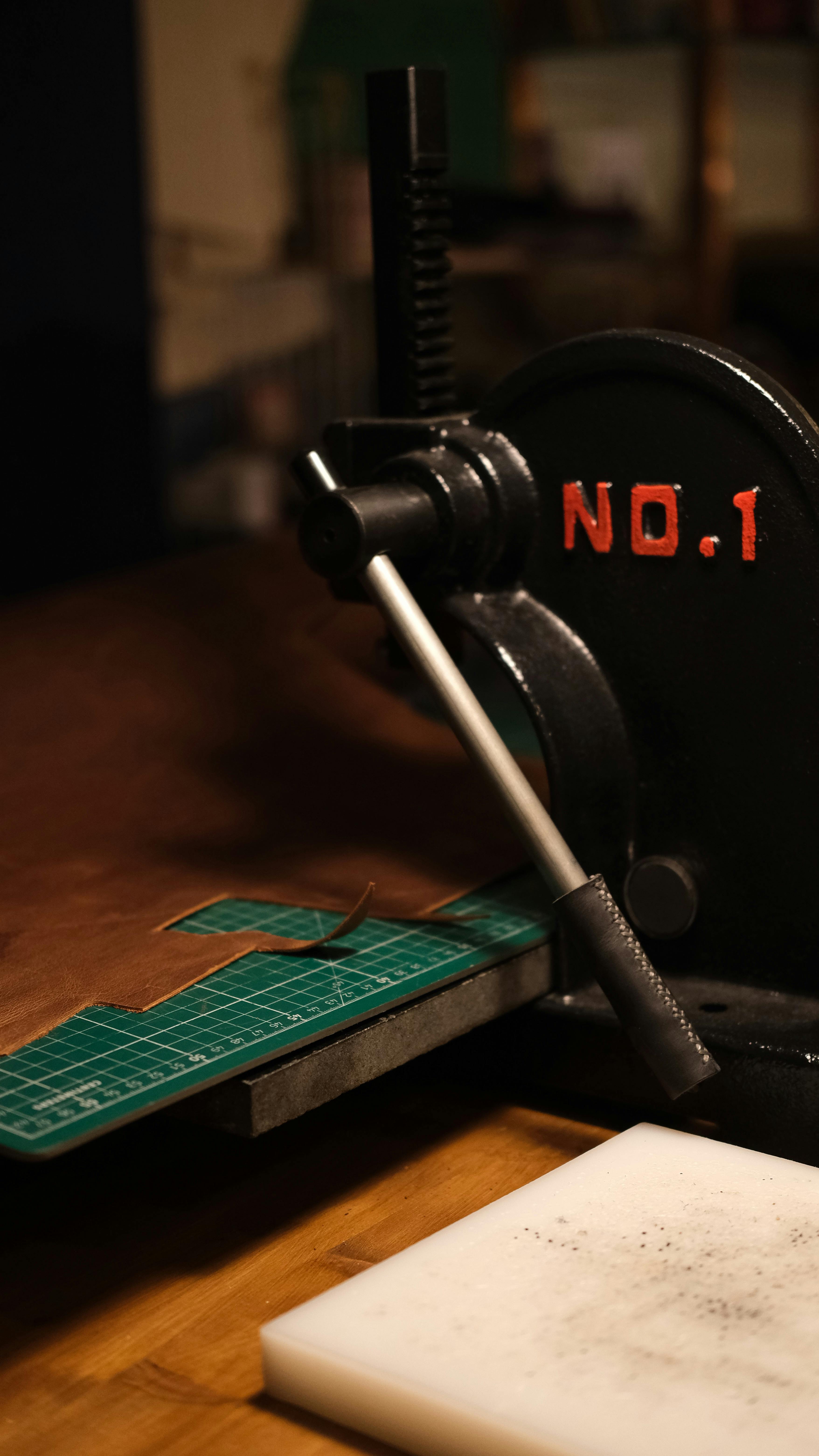 Vintage Paper Cutter in Workshop Setting · Free Stock Photo