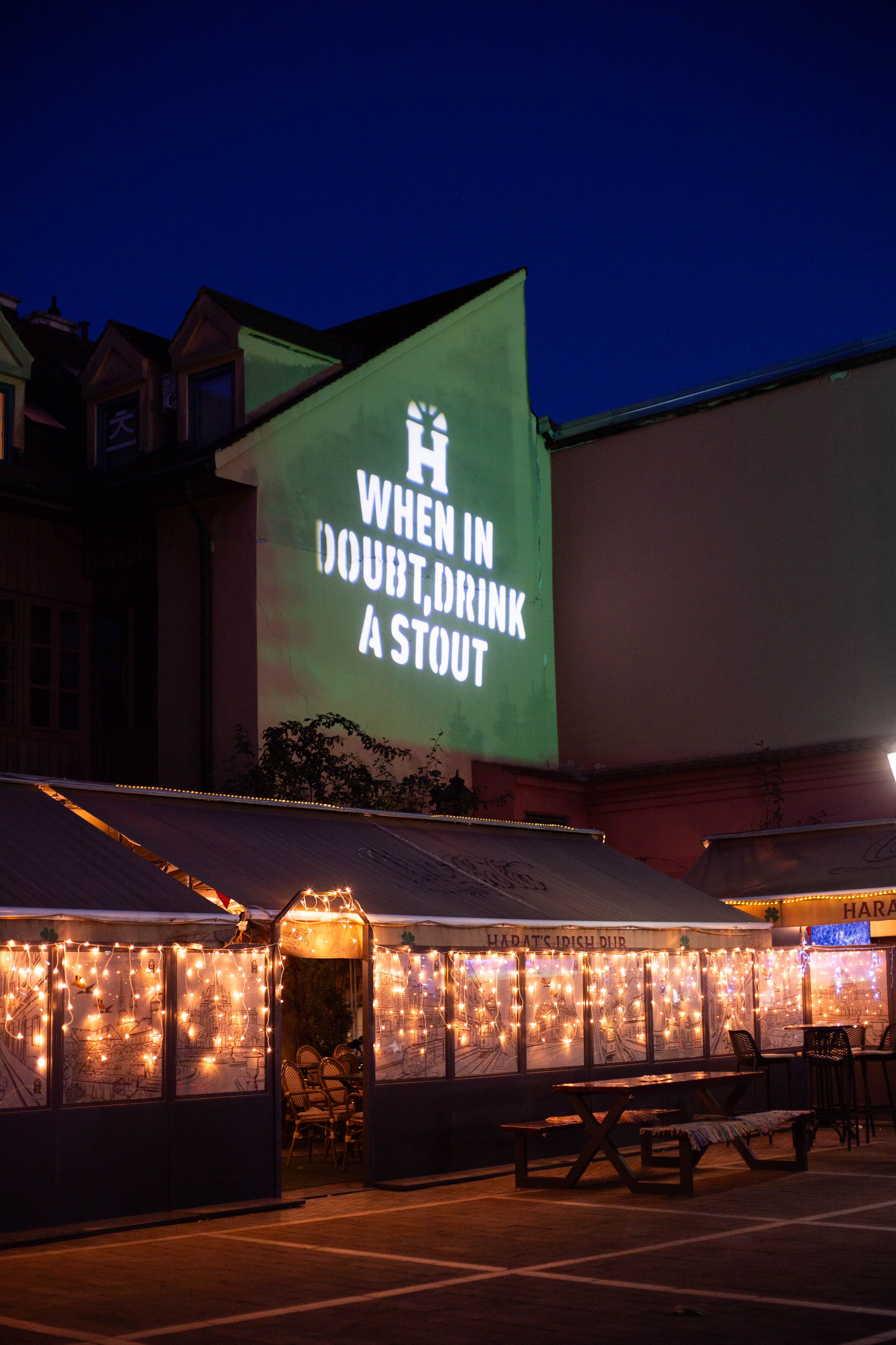Cozy Outdoor Pub at Night in Zagreb with Stout Sign · Free Stock Photo