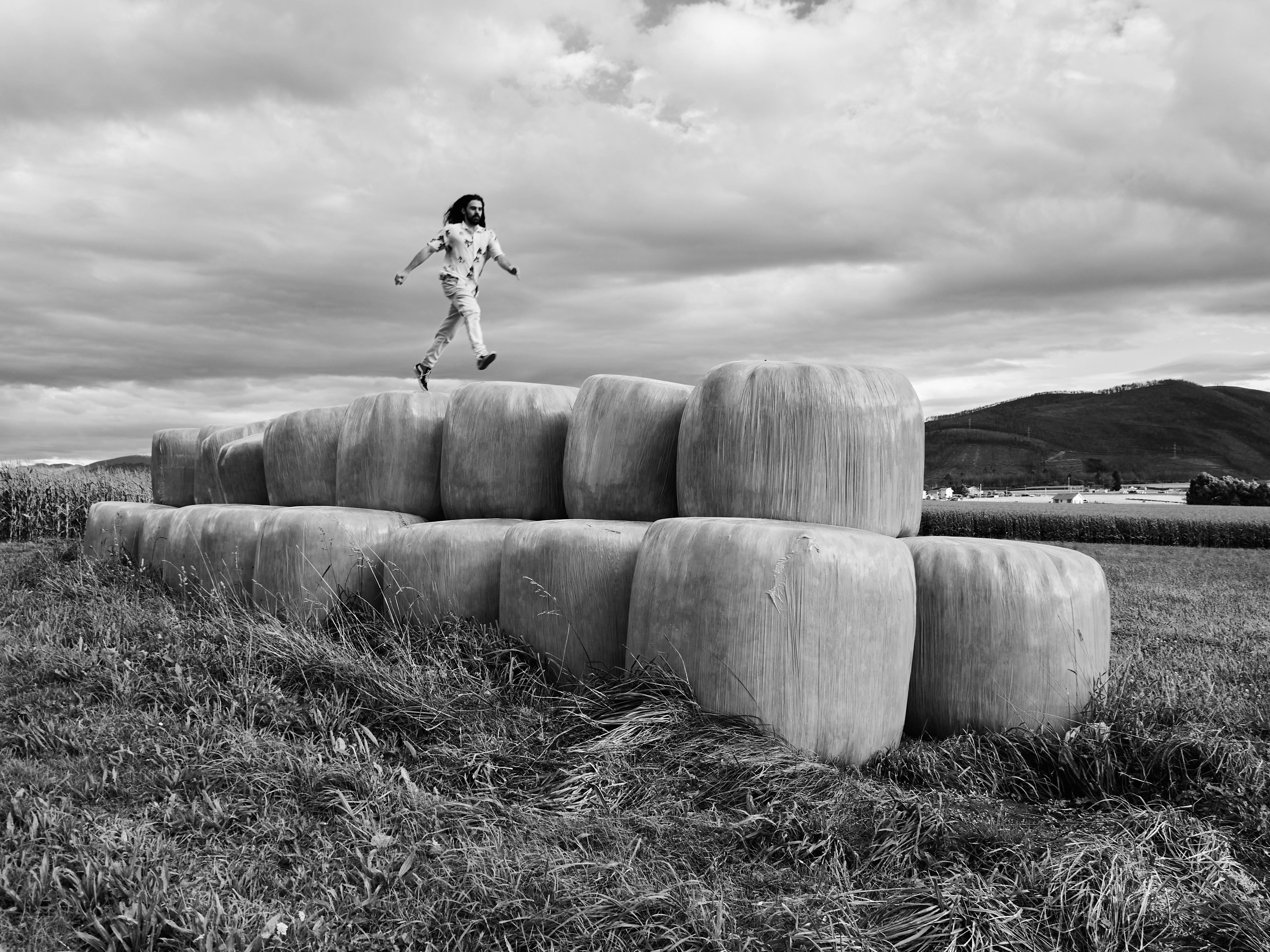 Child Playing on Hay Bales in the Countryside · Free Stock Photo