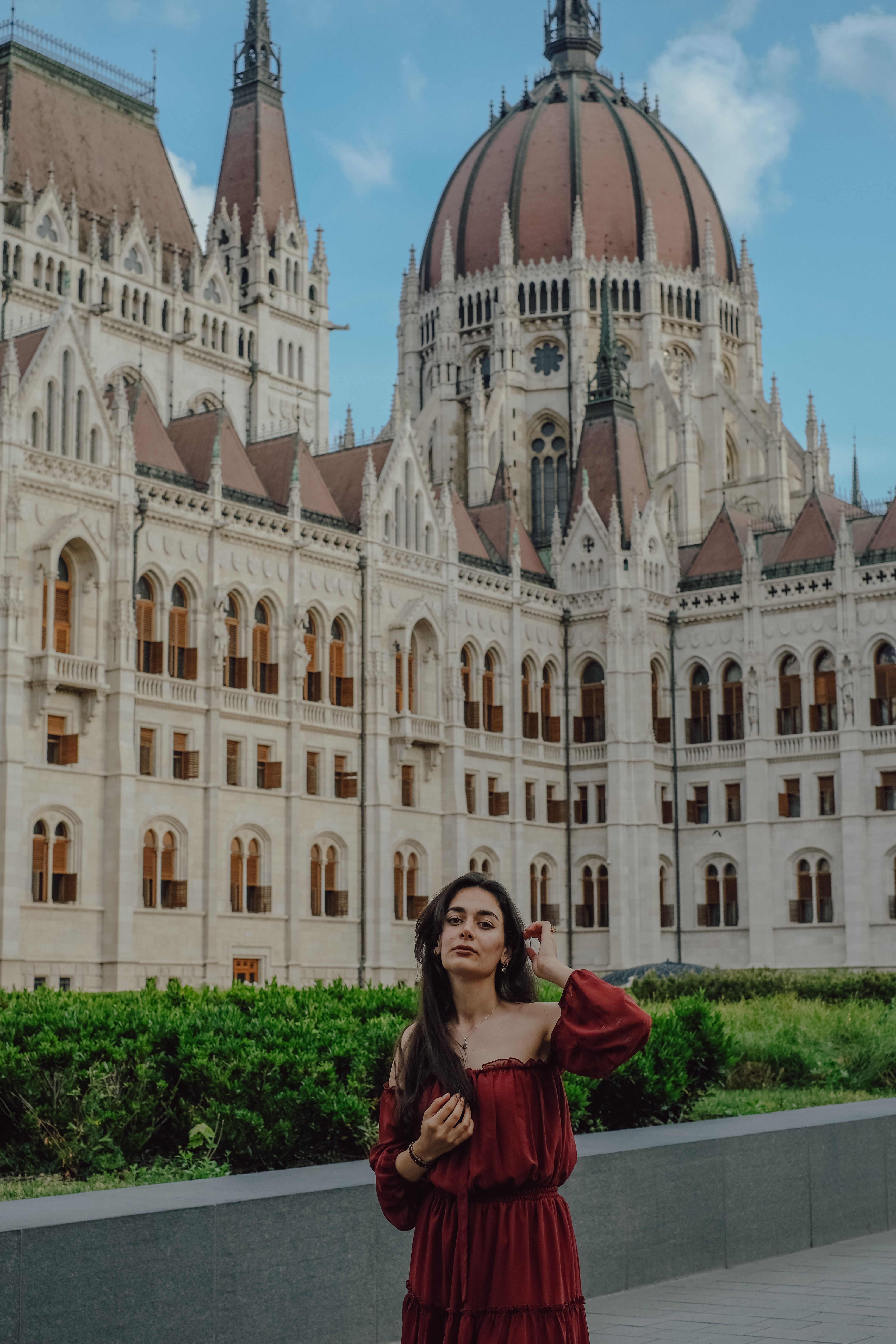 Woman in Red Dress in Front of Budapest Parliament · Free Stock Photo