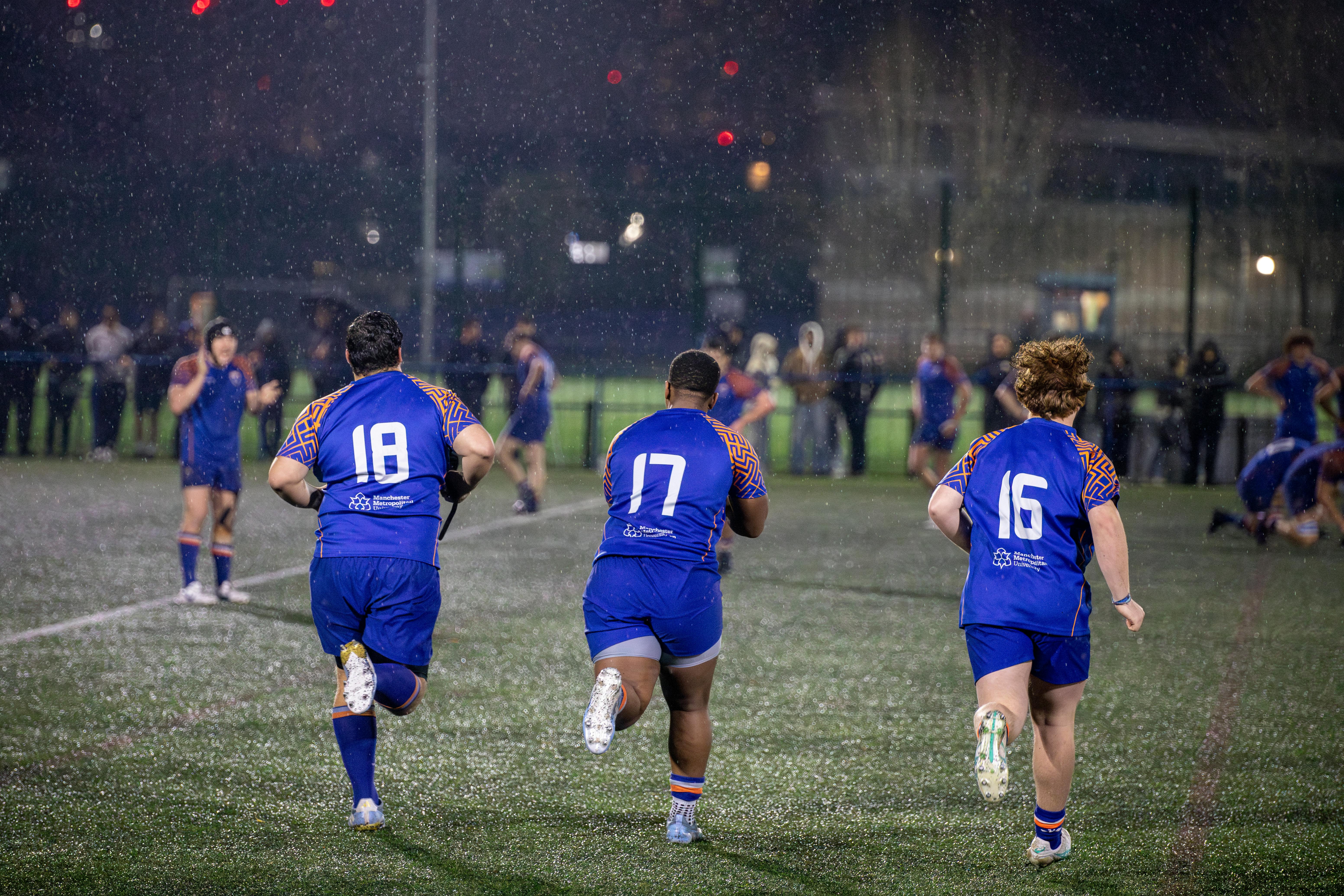 Rugby Players in Action During Night Match · Free Stock Photo