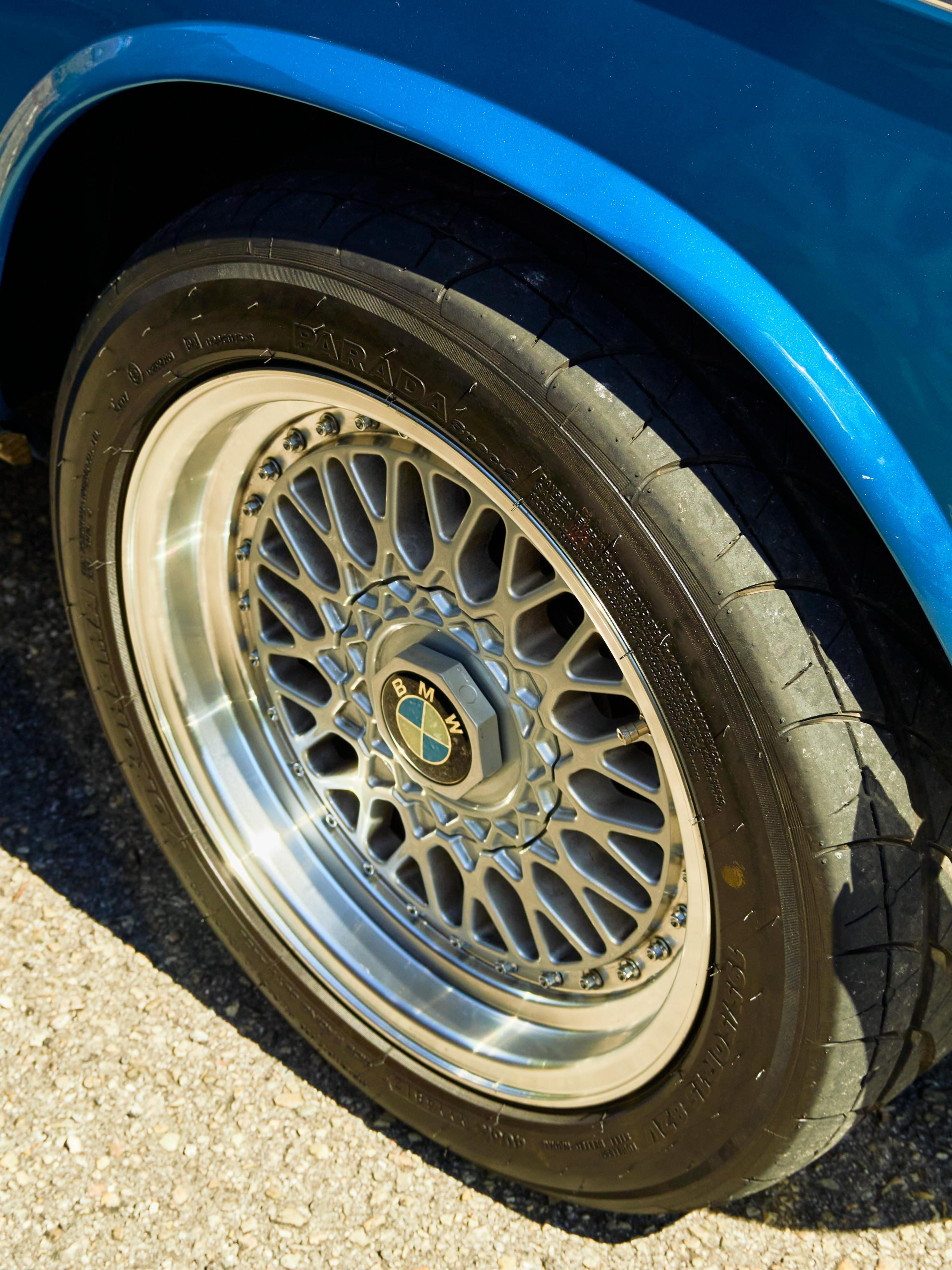 Close-up of Classic Car Wheel on Asphalt · Free Stock Photo