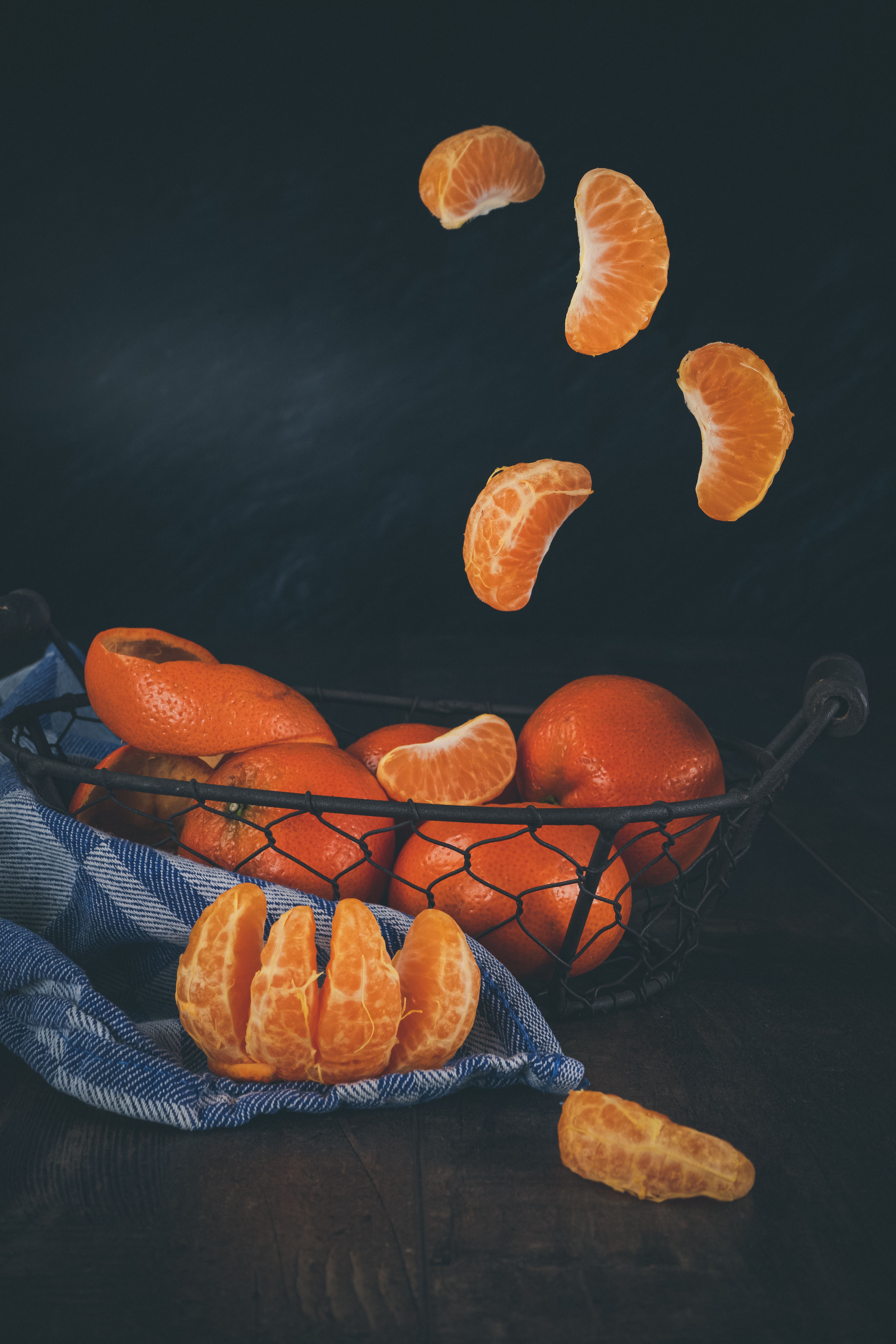 Creative Still Life with Floating Tangerine Segments · Free Stock Photo
