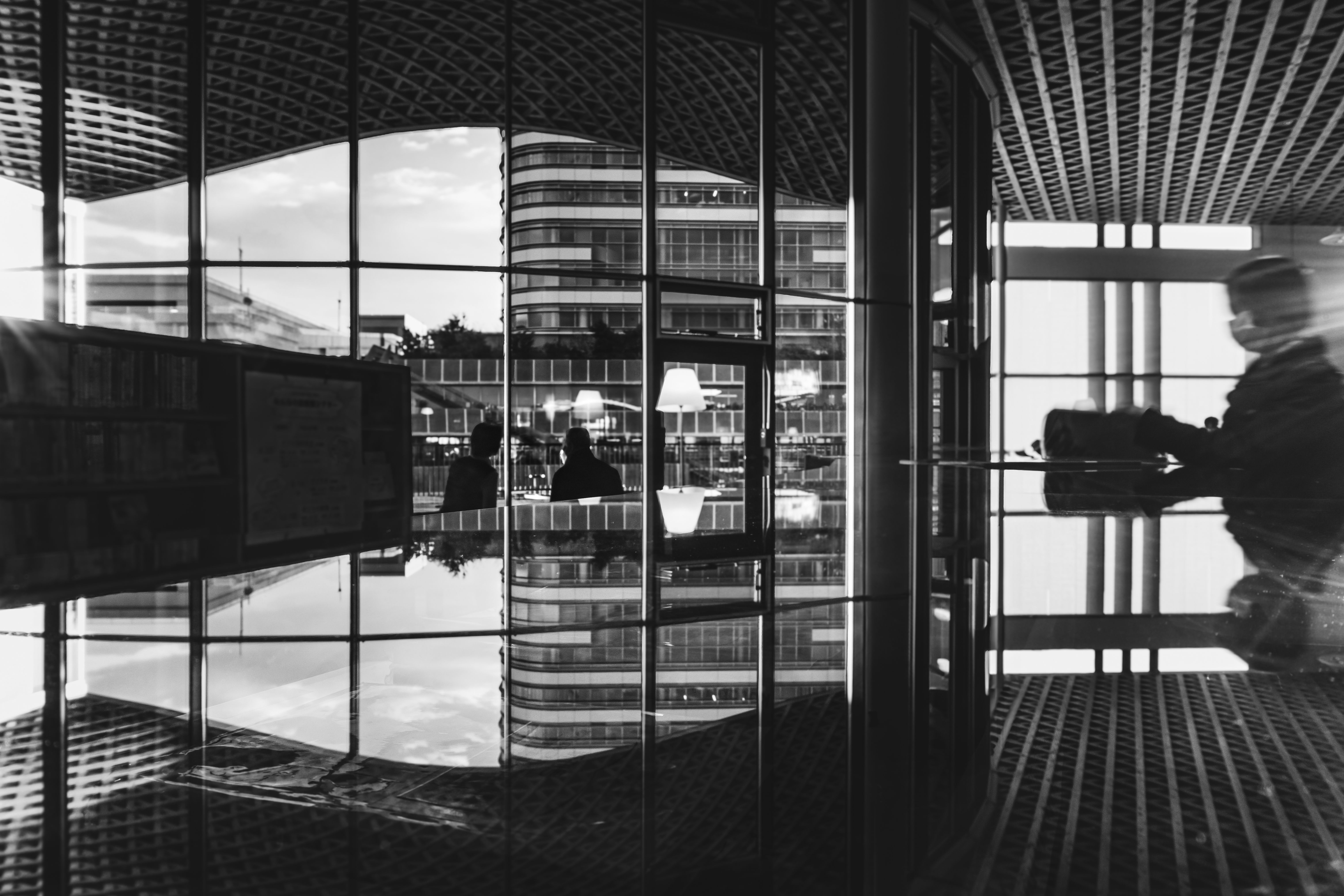 Reflective Architectural Interior with Silhouettes · Free Stock Photo
