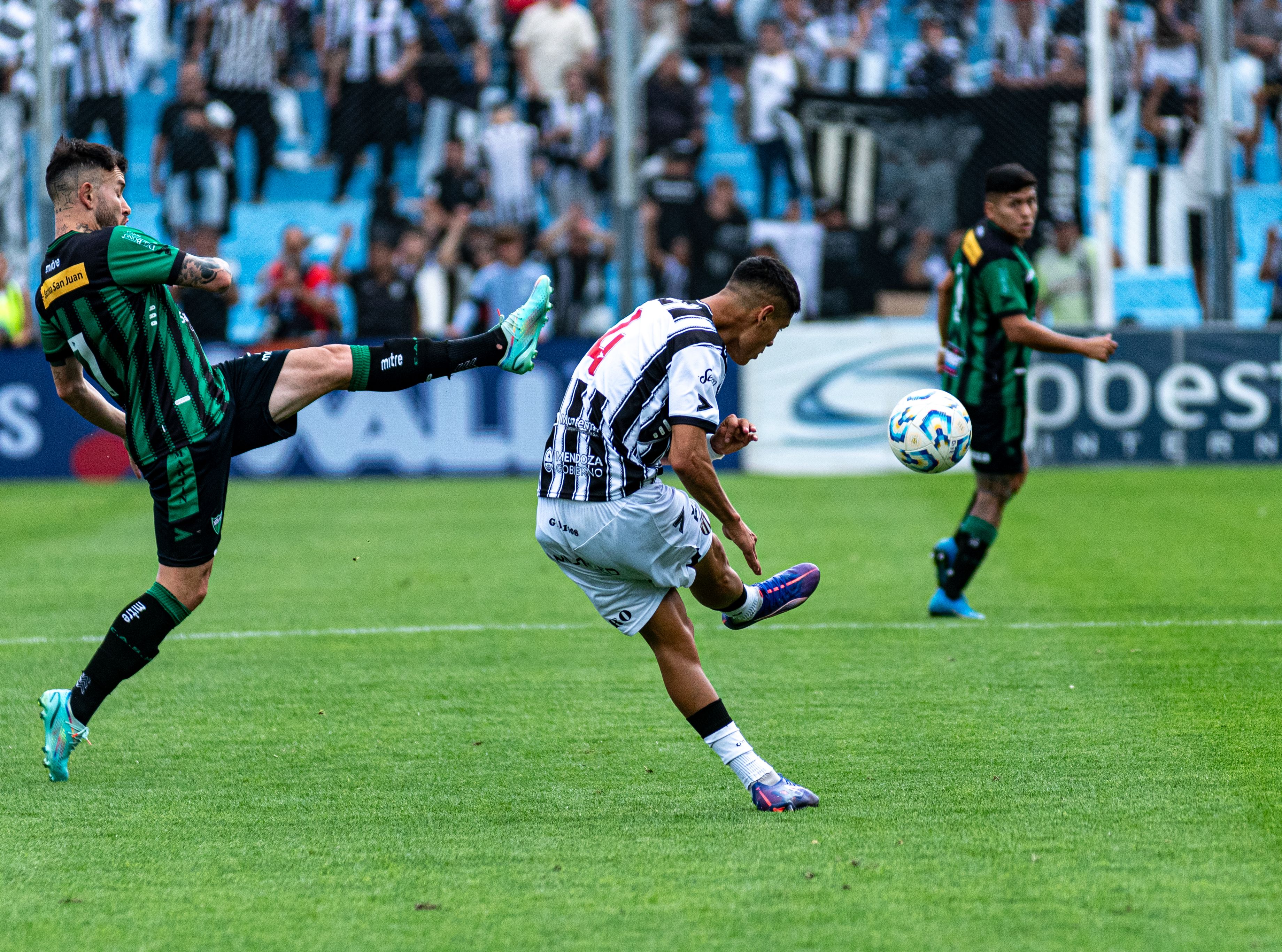 Intense Soccer Match Action Captured on Field · Free Stock Photo