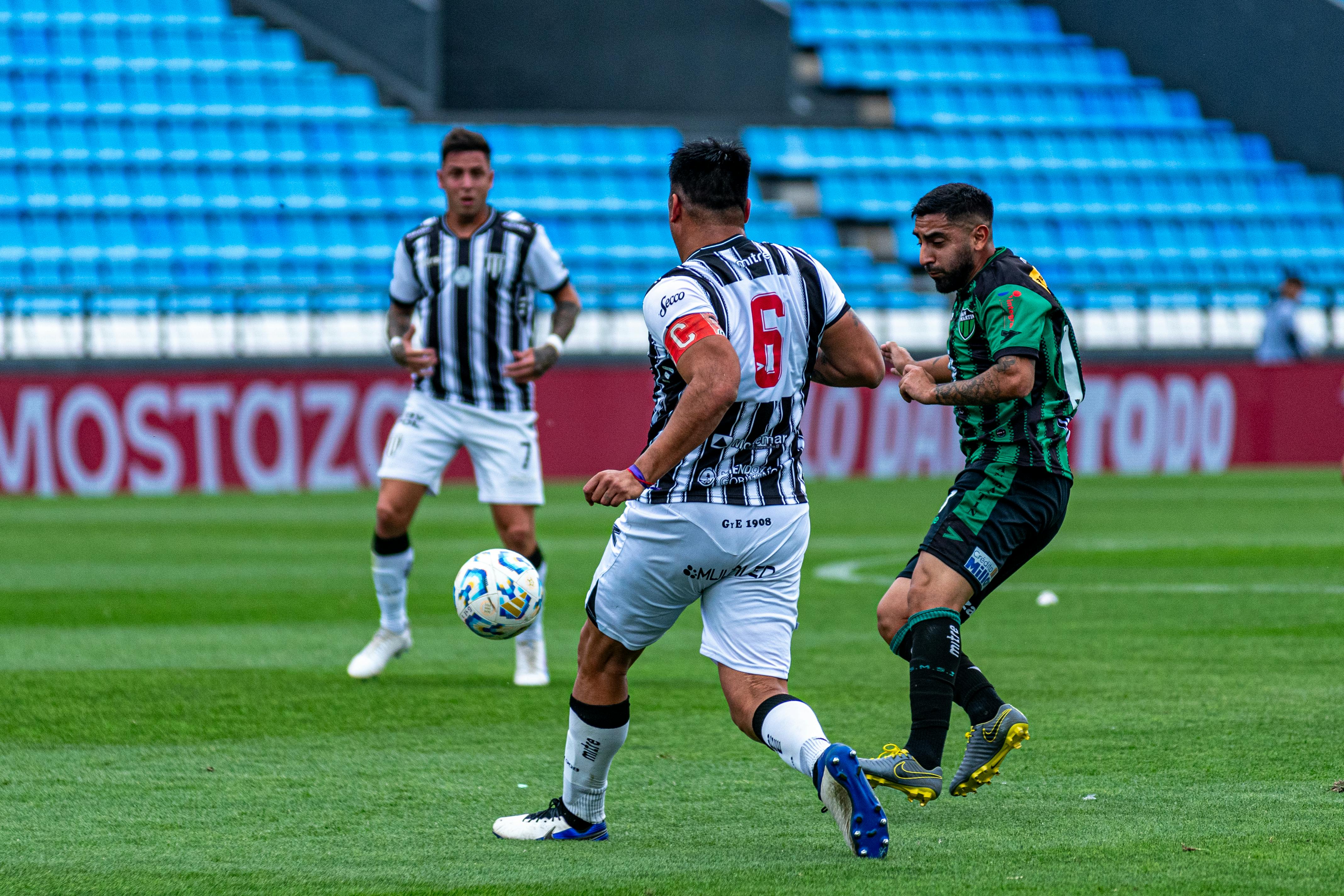 Professional Soccer Match Action on Field · Free Stock Photo