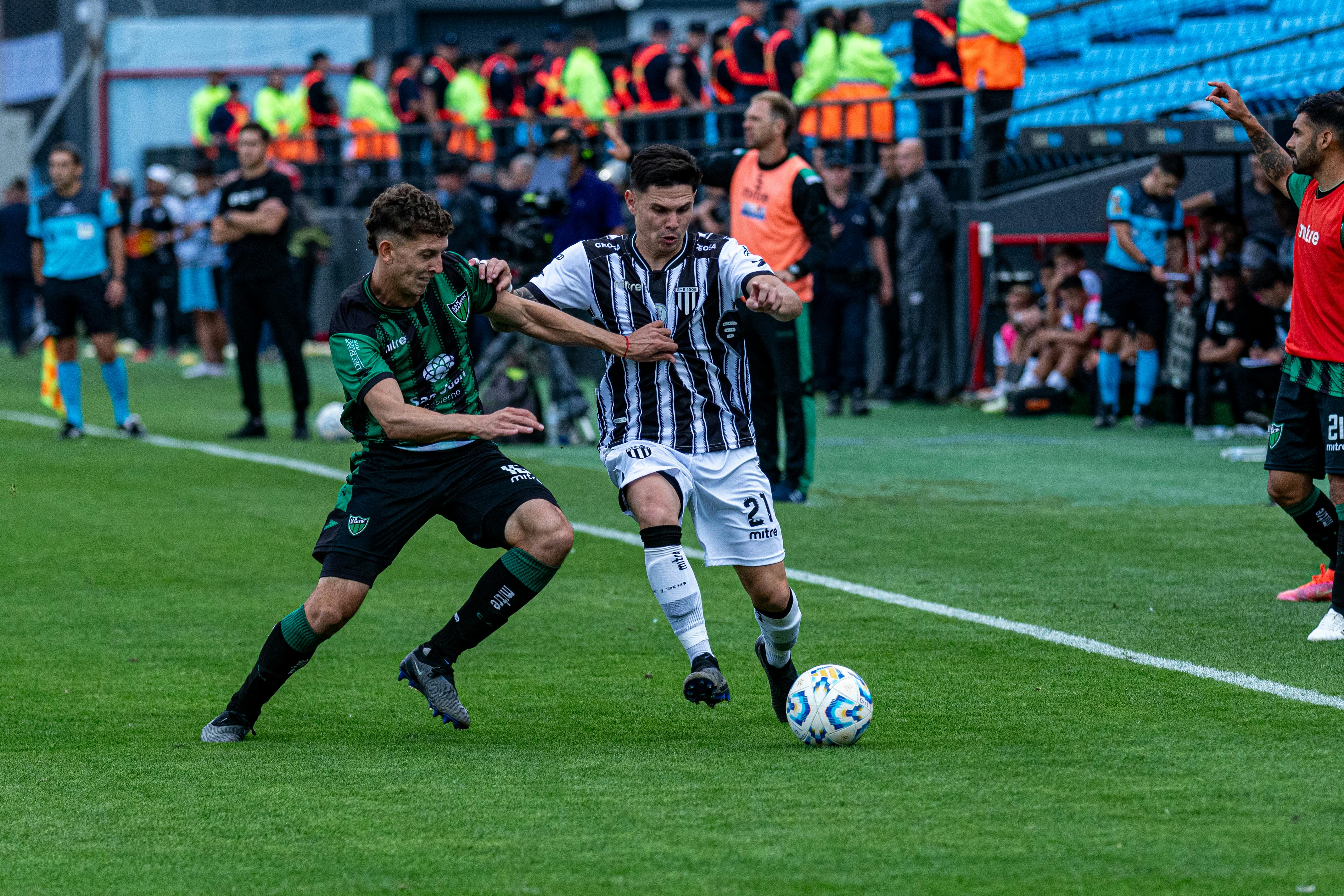 Intense Soccer Match in Outdoor Stadium · Free Stock Photo