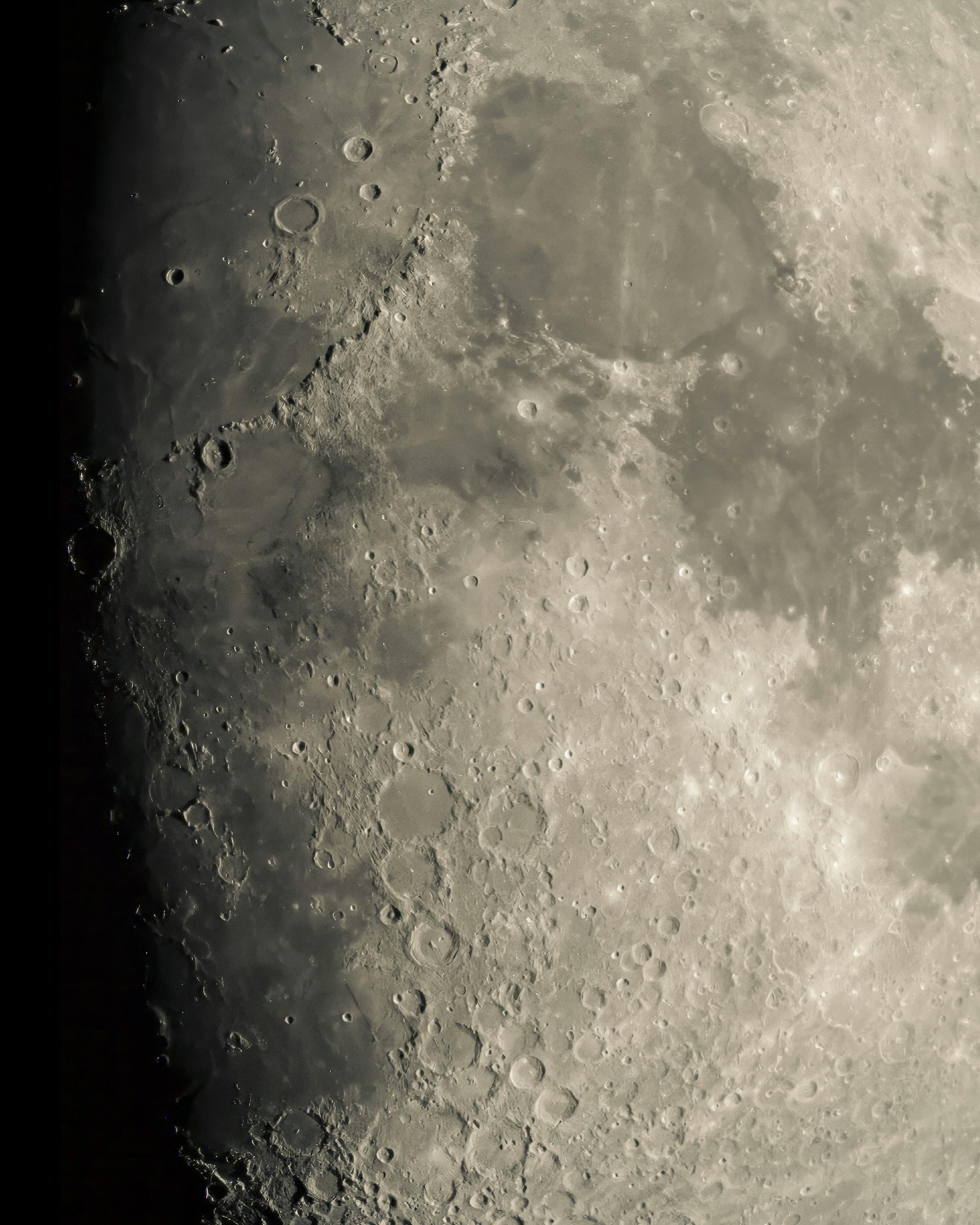 Close-up View of the Moon's Surface Showing Craters · Free Stock Photo