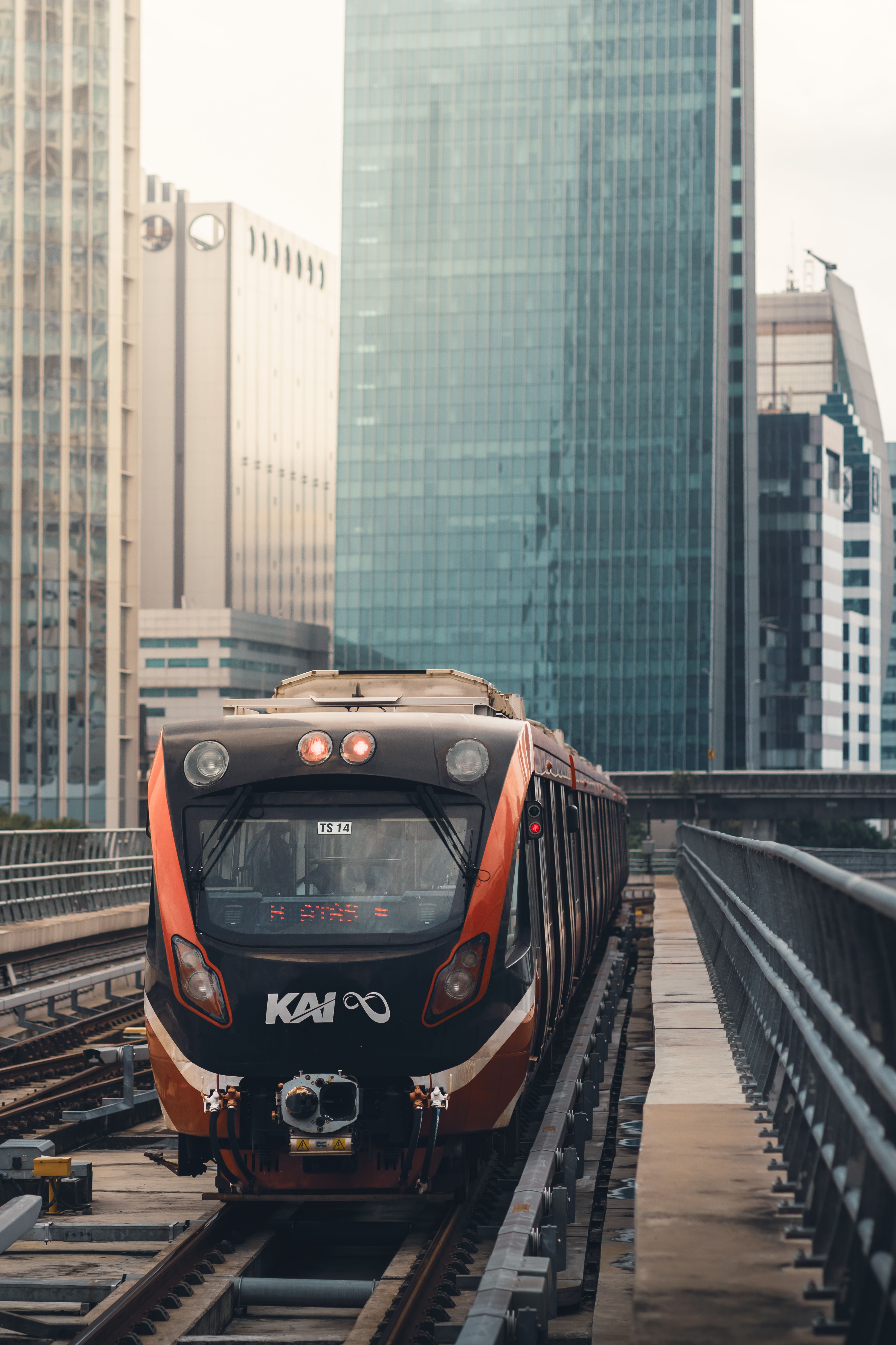 Modern Train on Urban Tracks in Jakarta · Free Stock Photo