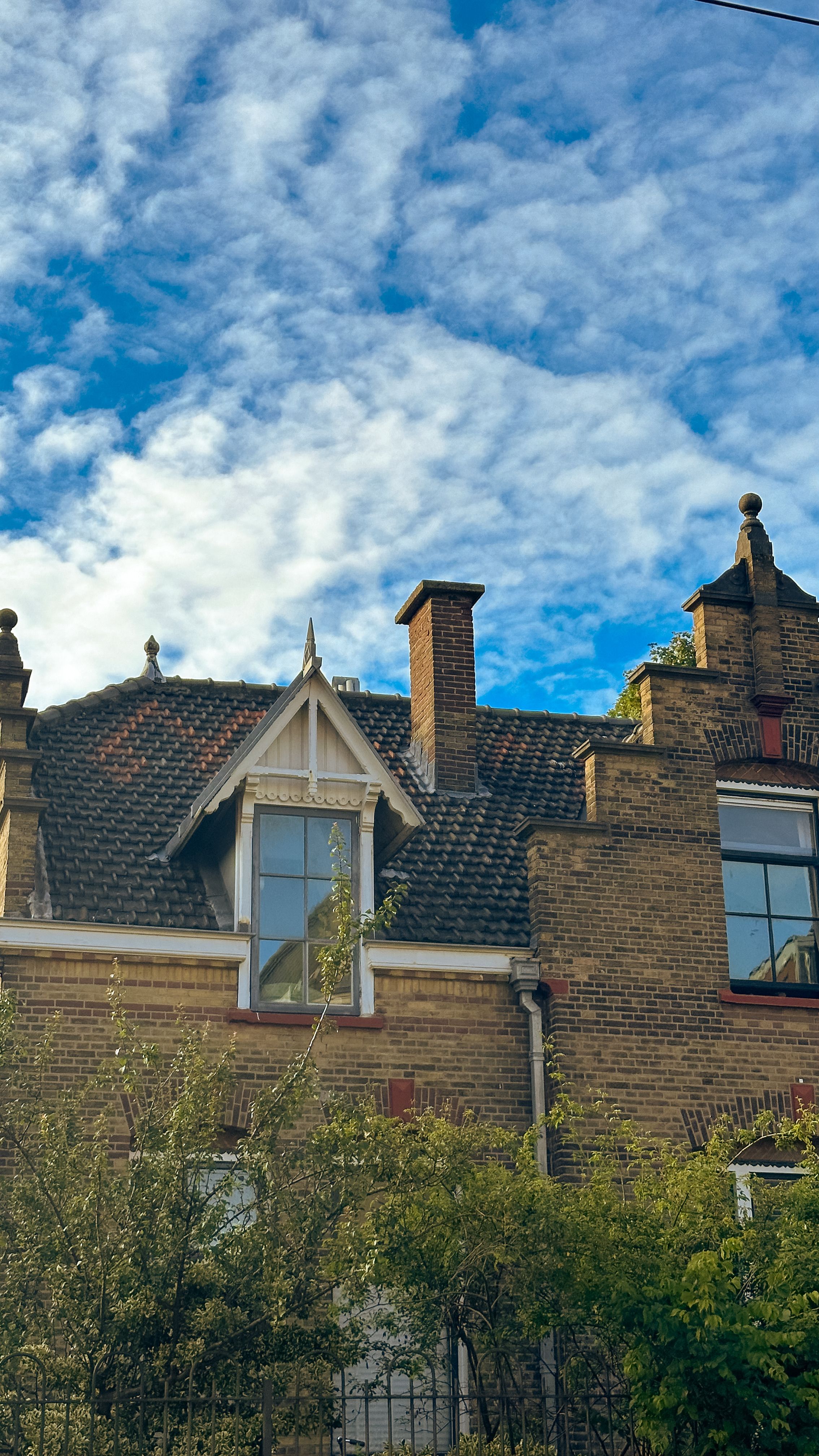 Historic Brick Building with Gabled Roof · Free Stock Photo