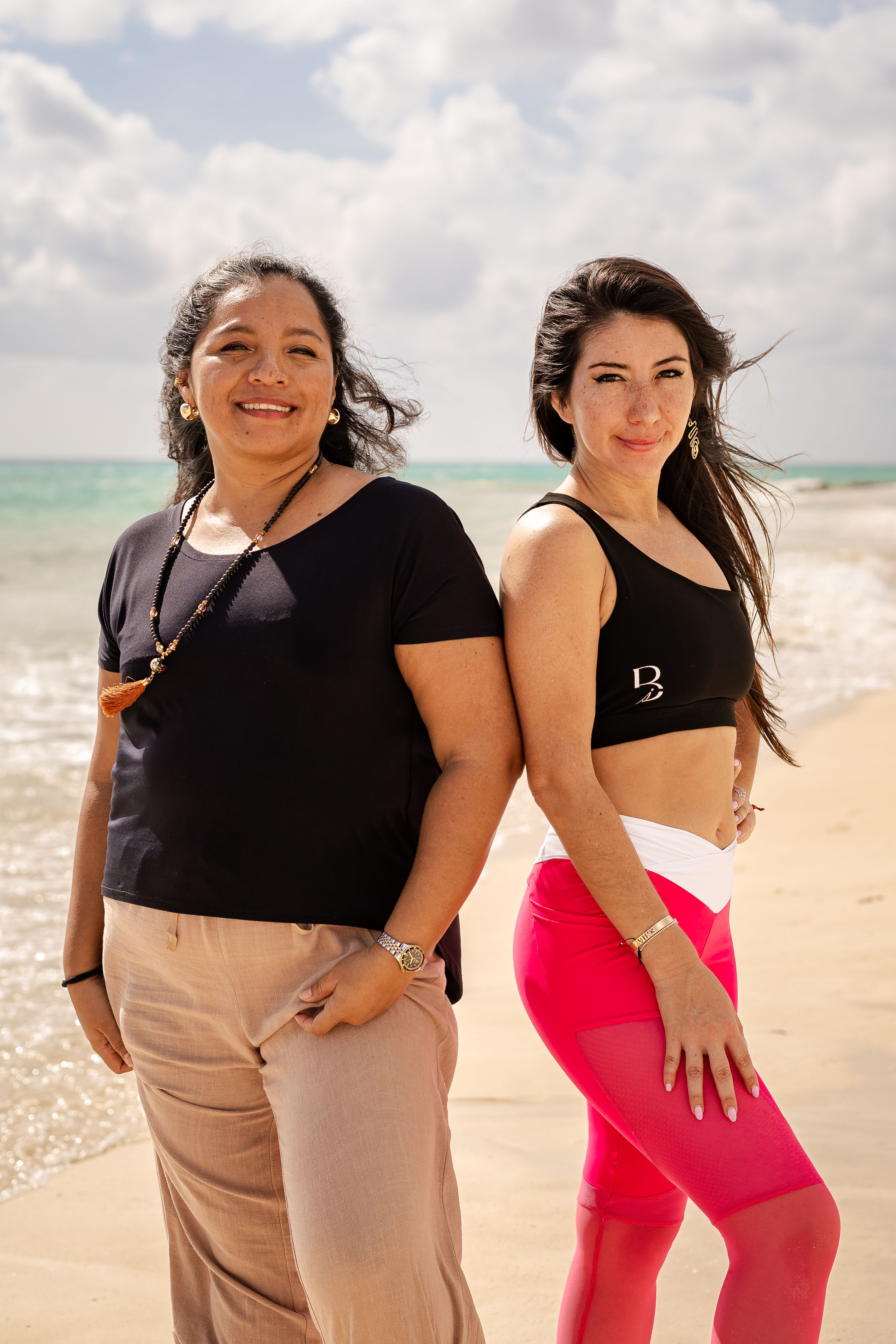 Two Women Enjoying a Sunny Day at the Beach · Free Stock Photo