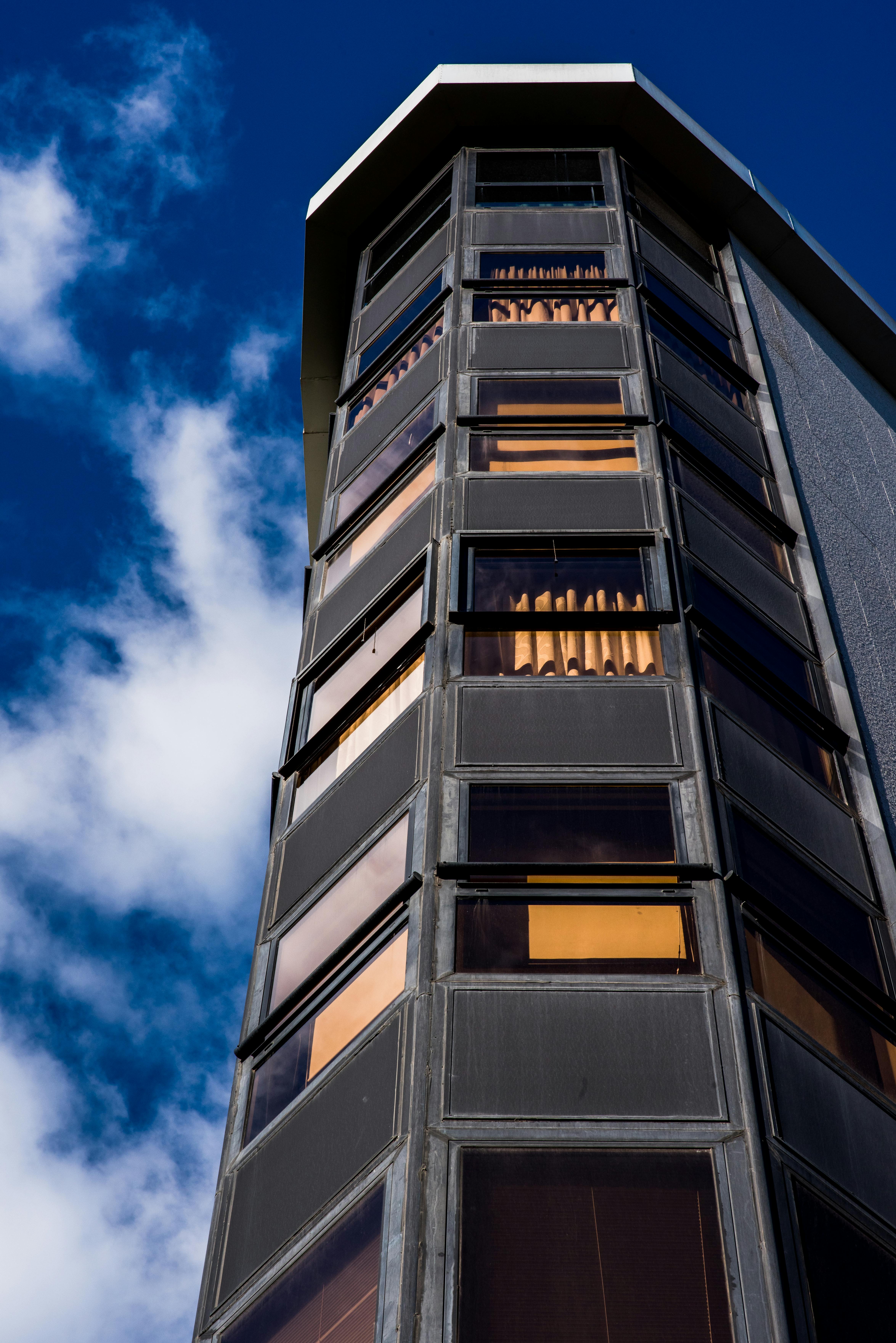 Modern Angular Building Against Blue Sky · Free Stock Photo