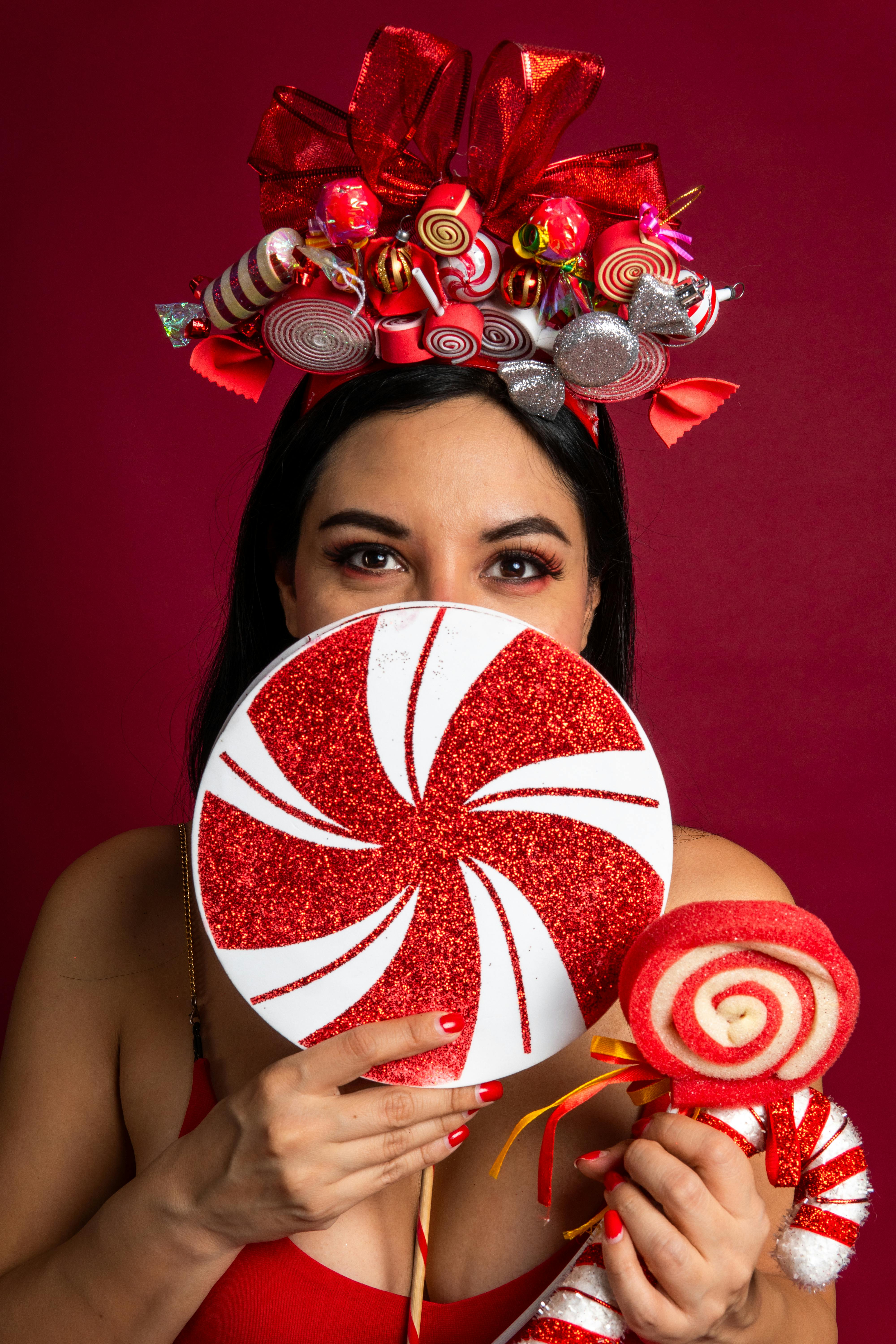 Festive Woman with Candy-Themed Headpiece · Free Stock Photo