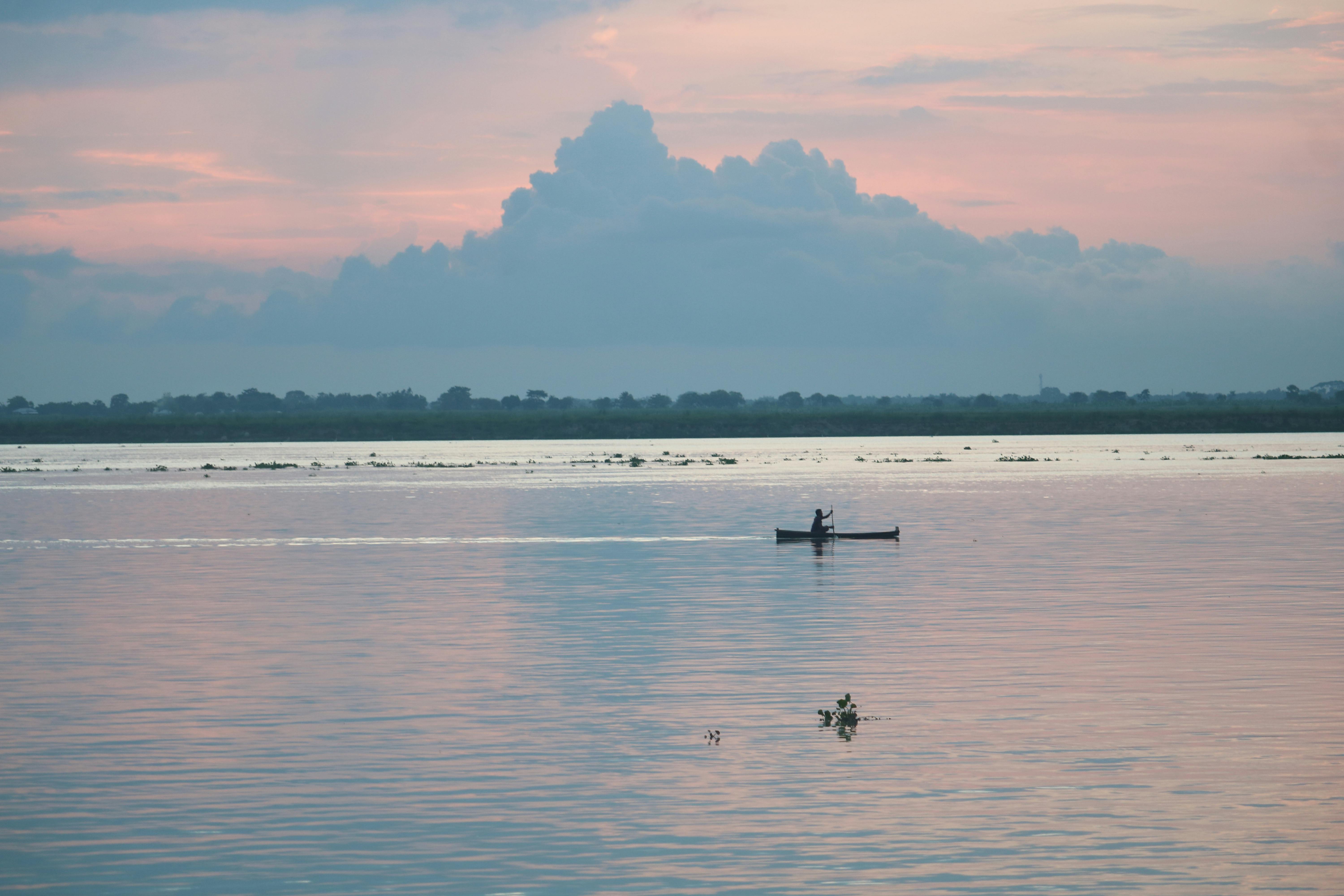 Tranquil Boat on Padma River at Sunset · Free Stock Photo