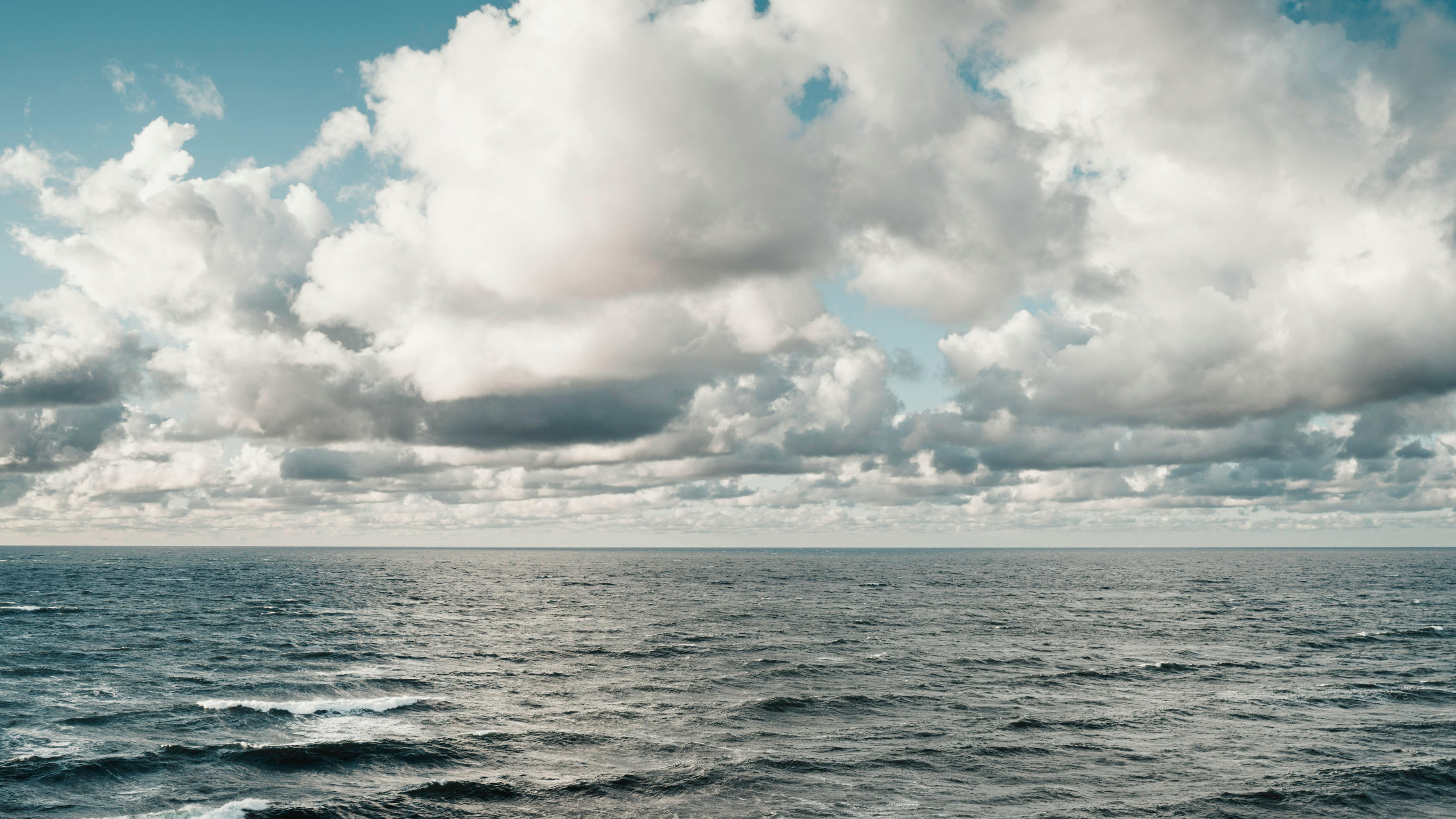 Dramatic Cloudscape Over the Open Sea · Free Stock Photo