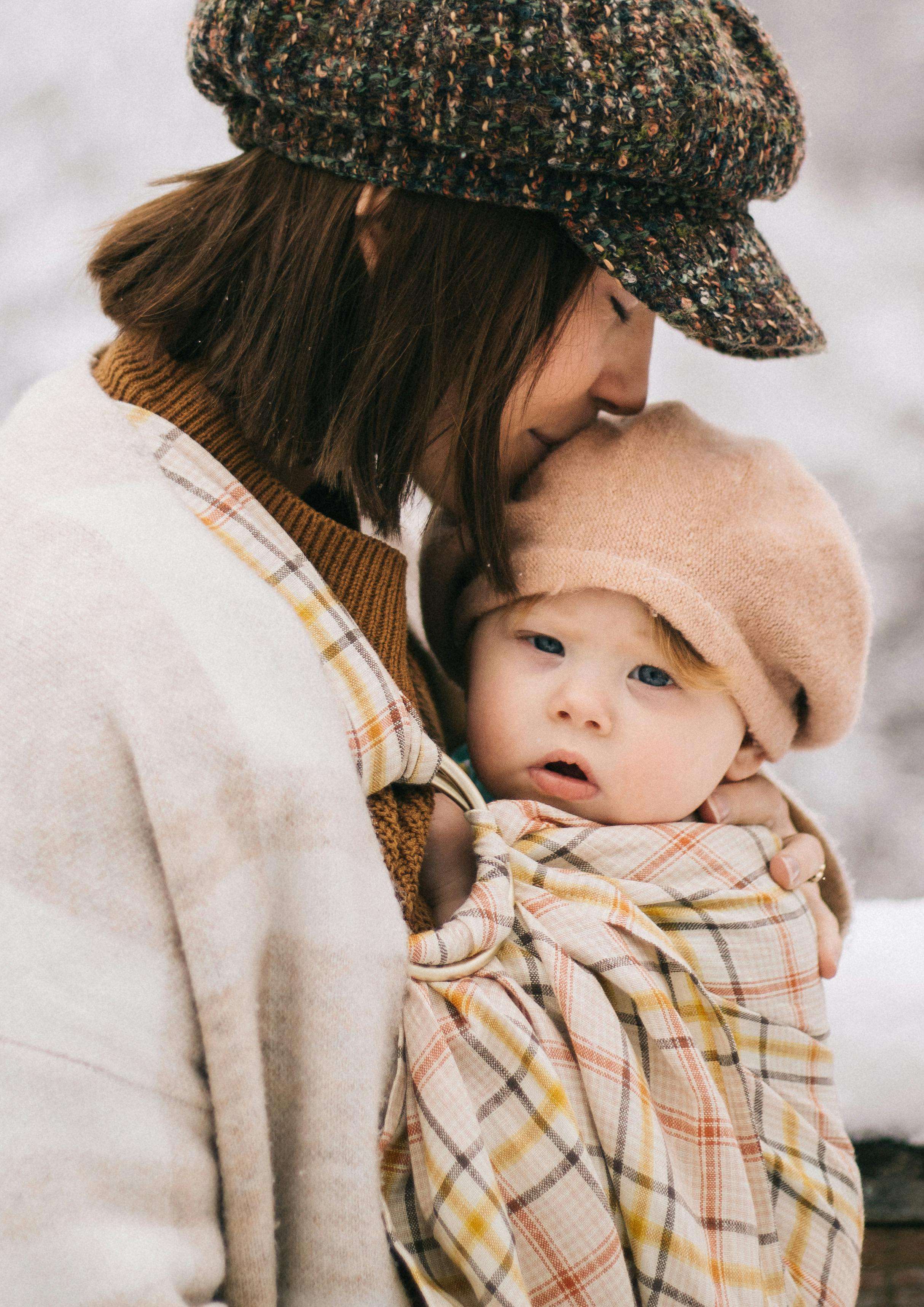Tender Mother and Child Bonding in Winter Scene · Free Stock Photo