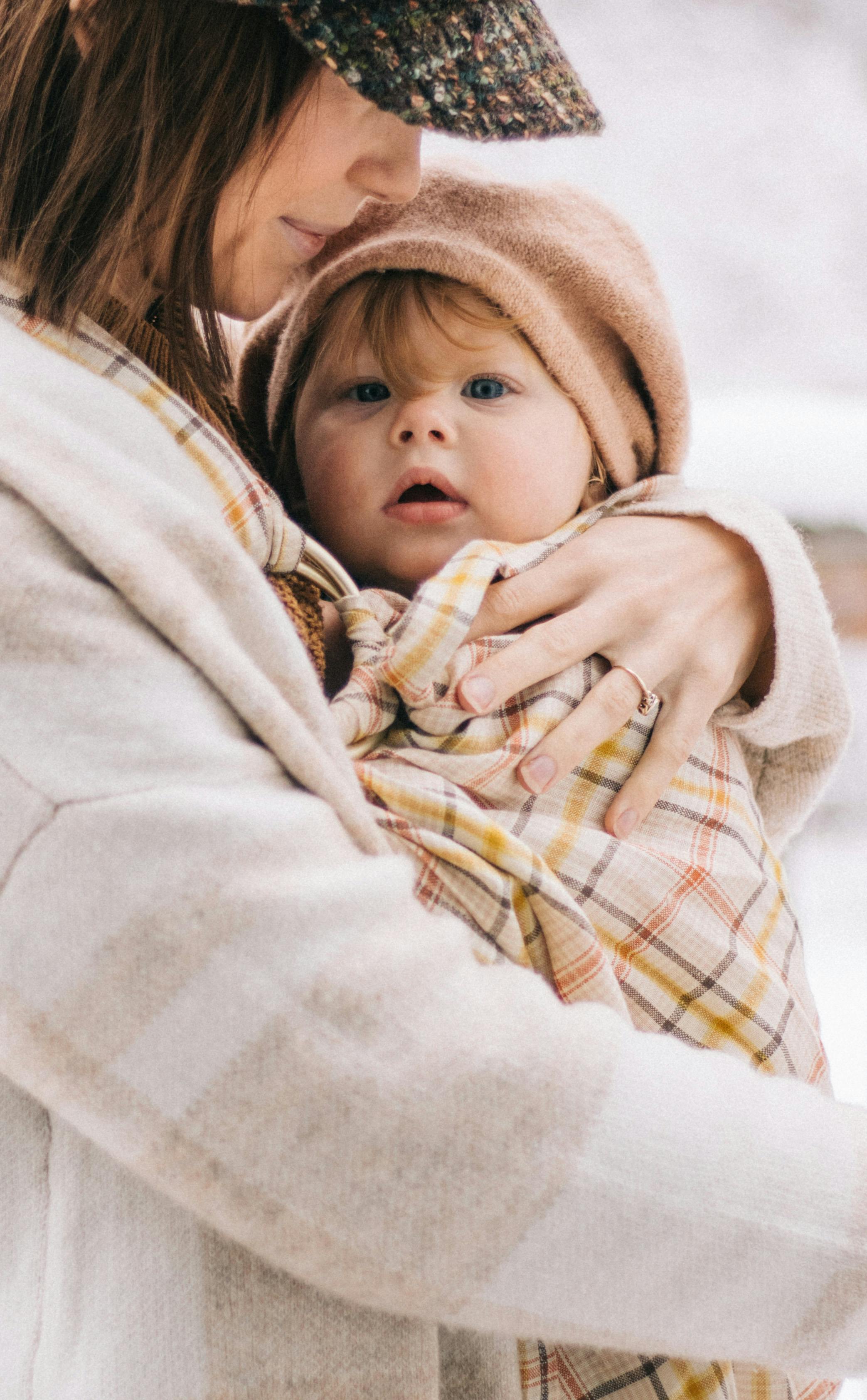 Cozy Mother and Baby in Winter Setting · Free Stock Photo