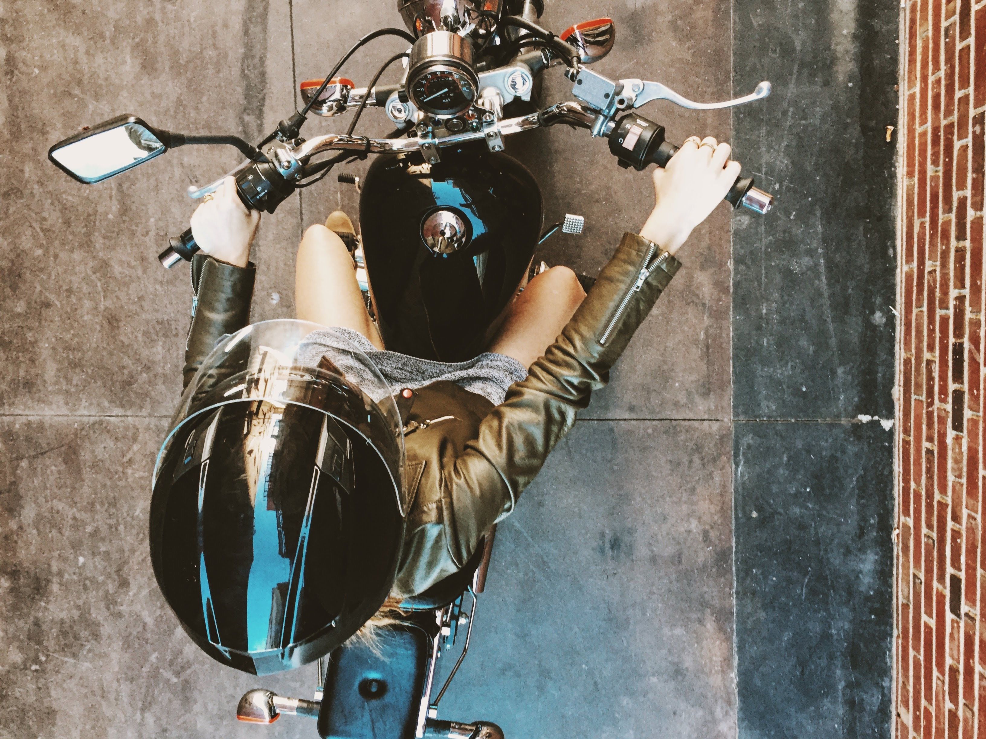 Top-Down View of Motorcycle Rider in Urban Setting · Free Stock Photo