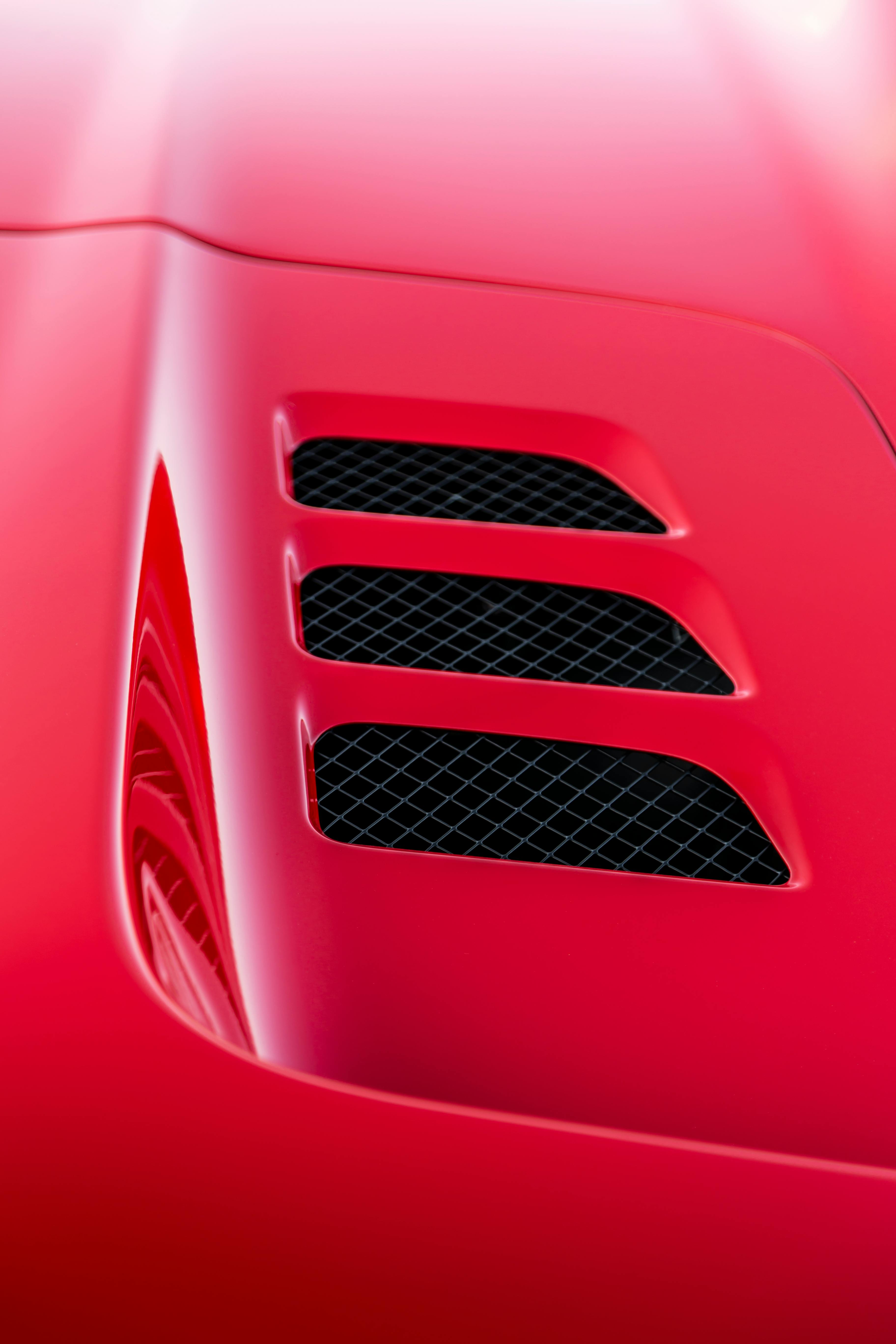 Close-Up of Red Supercar Air Vent Detail · Free Stock Photo