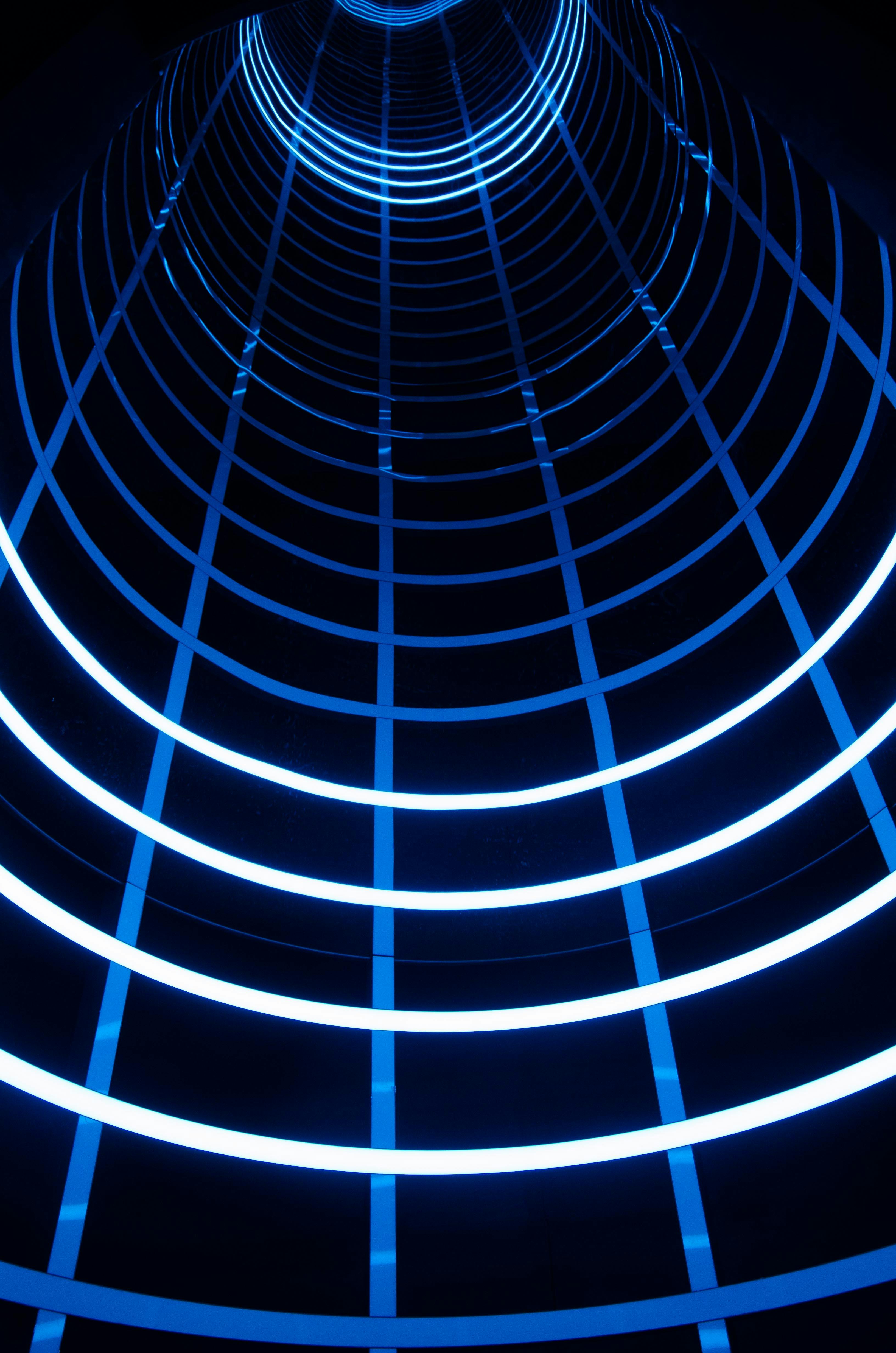 Futuristic Blue Light Tunnel with Geometric Patterns · Free Stock Photo