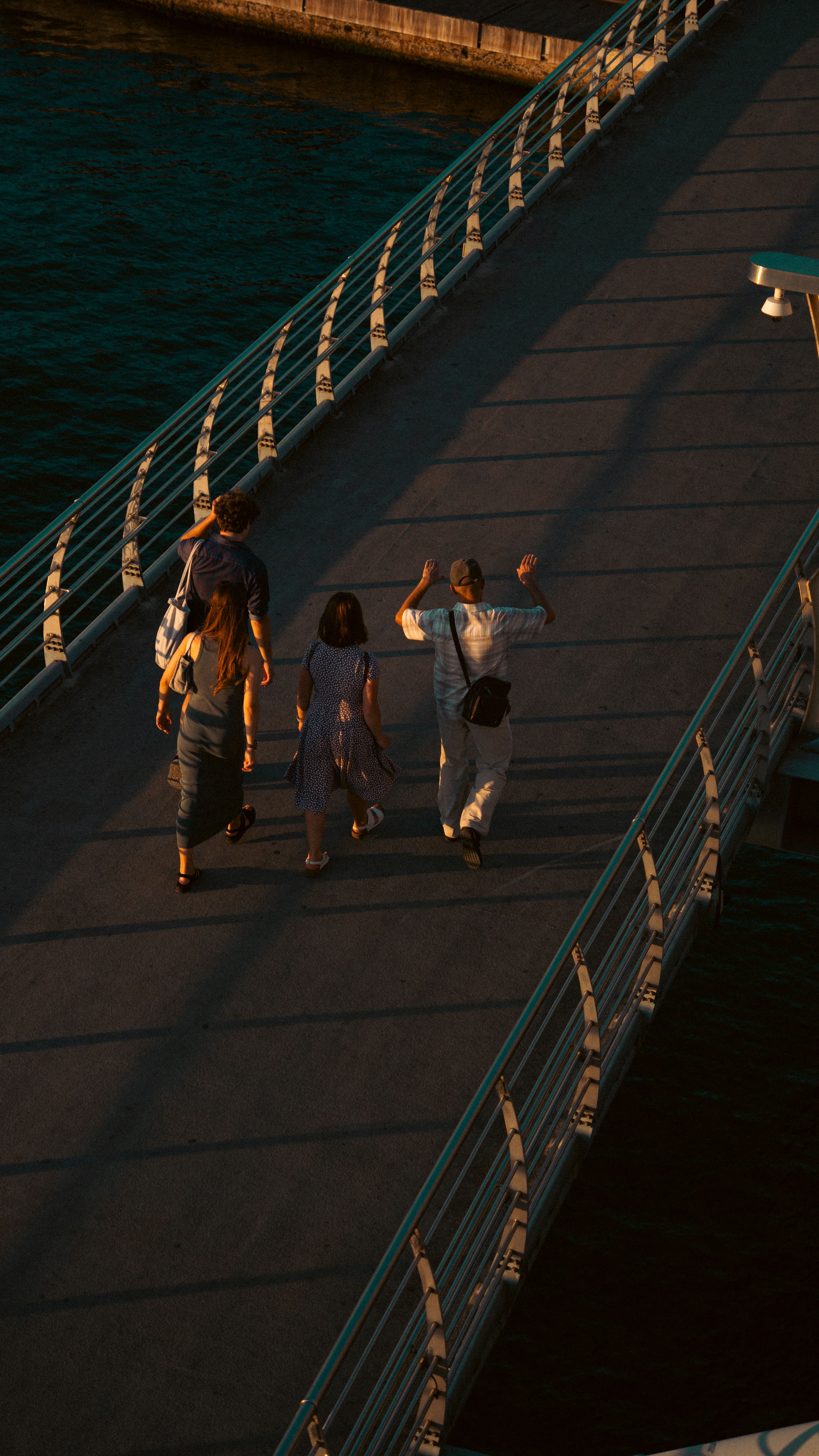 People Walking on an Urban Bridge at Sunset · Free Stock Photo