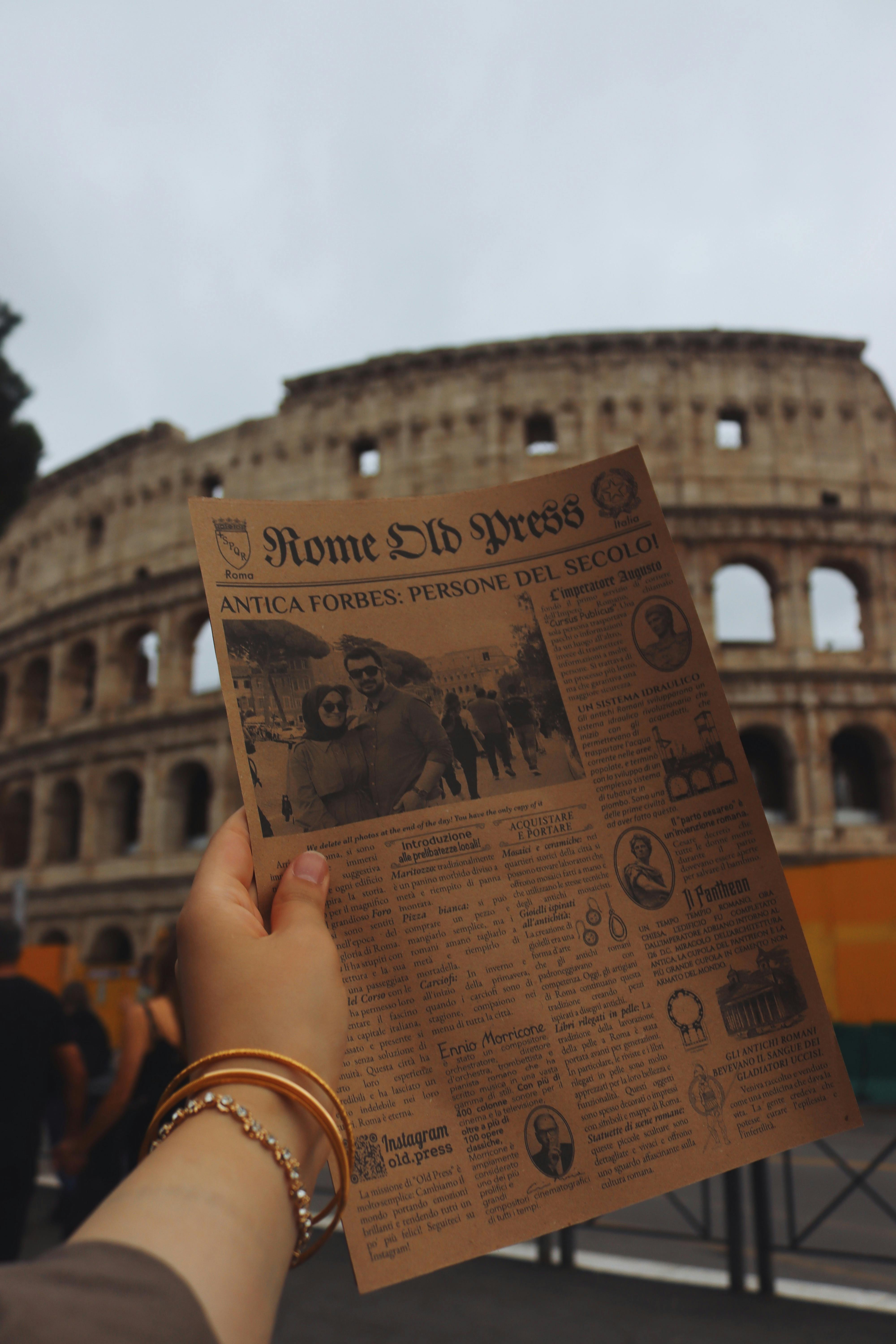 Colosseum with Vintage Newspaper Close-up · Free Stock Photo
