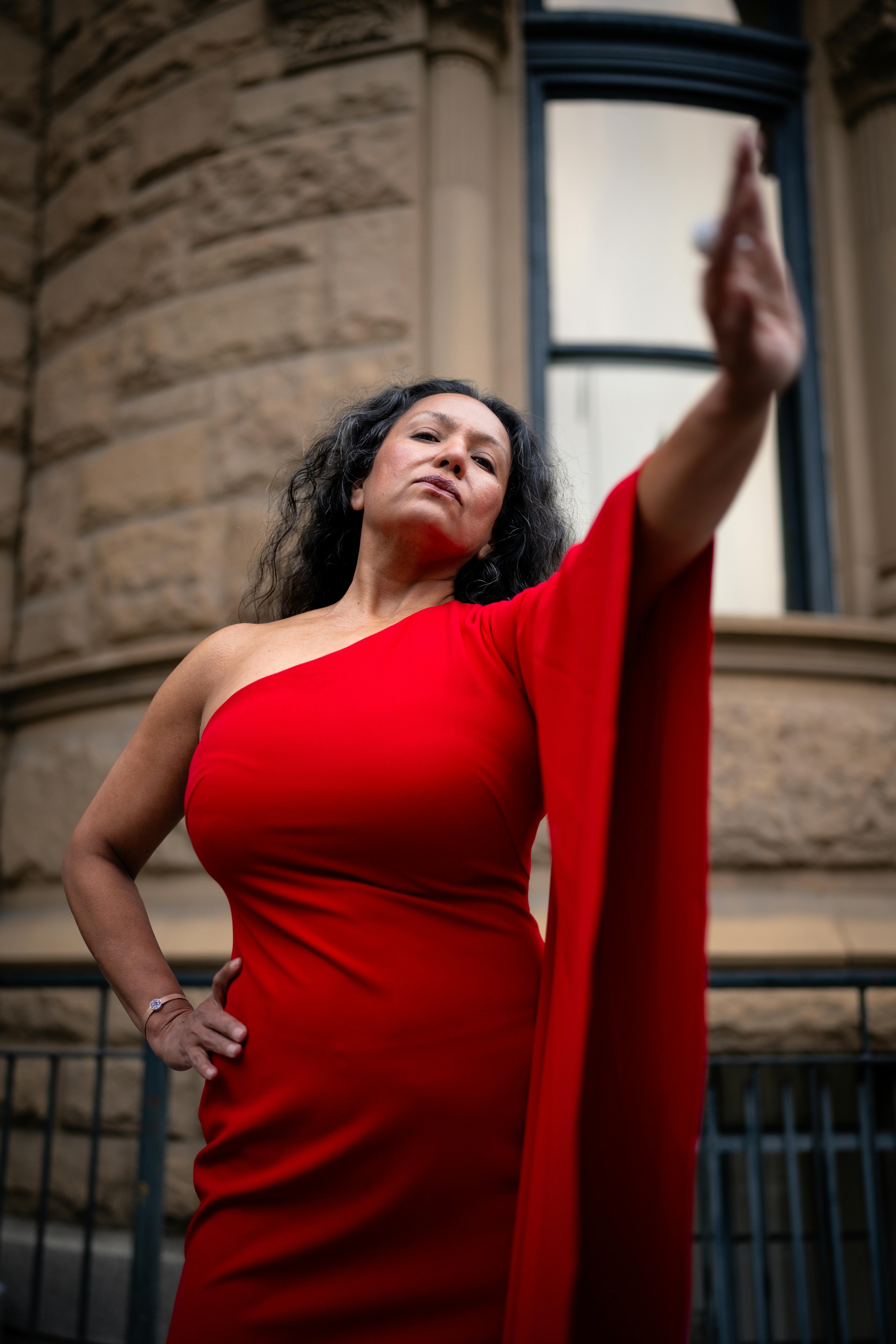 Elegant Woman in Red Dress Striking Poised Pose · Free Stock Photo