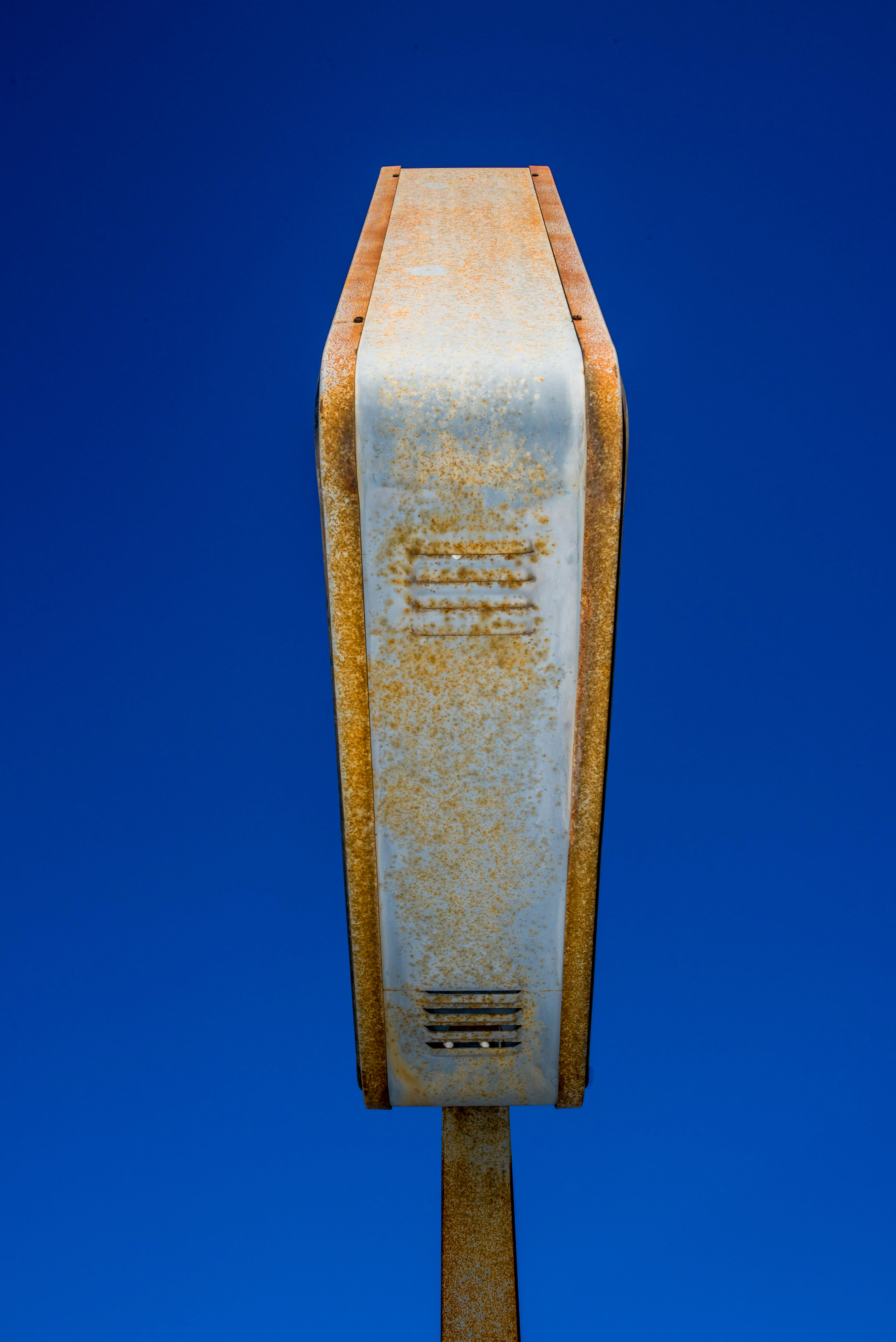 Rusty Metal Object Against Blue Sky · Free Stock Photo