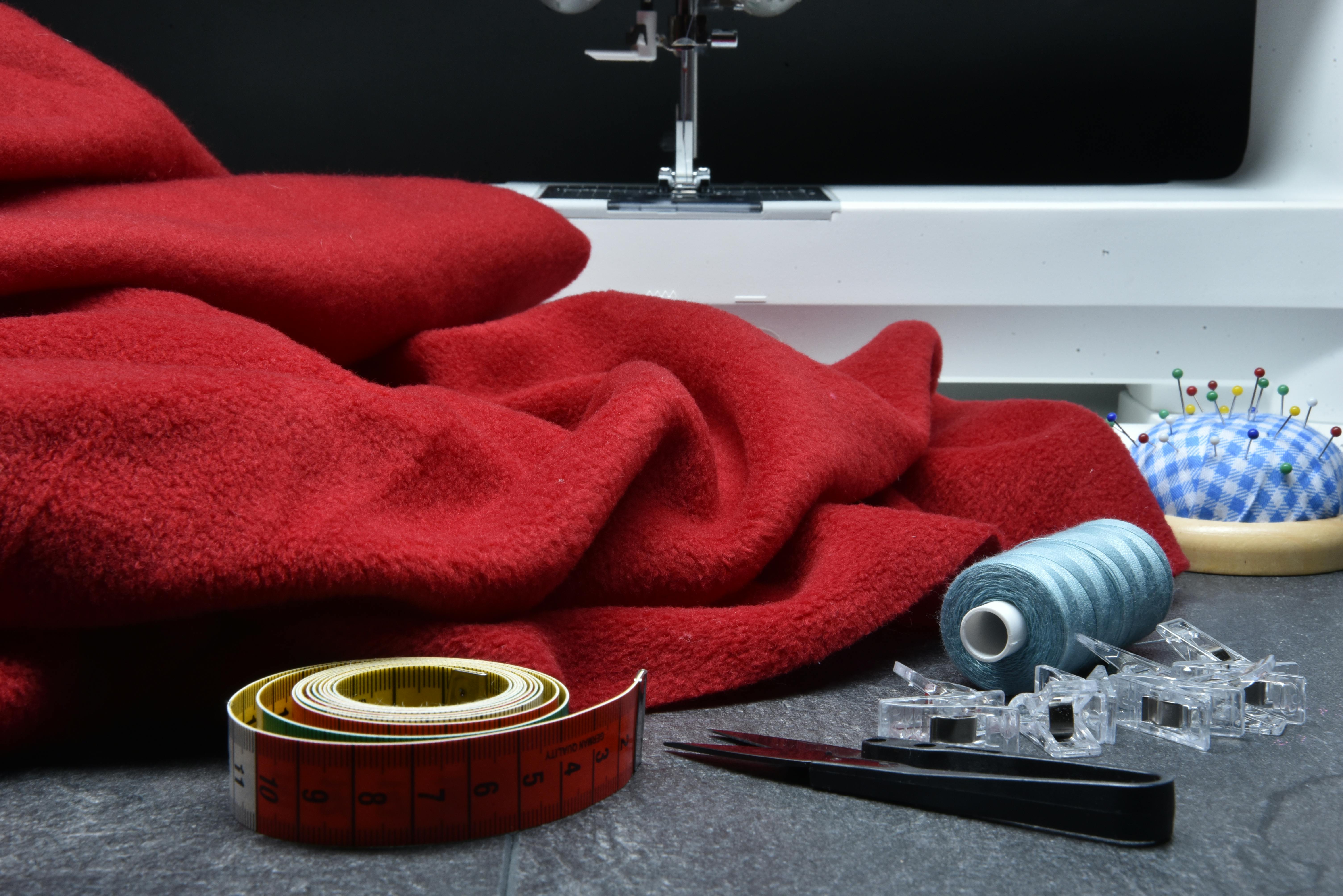 Red Fabric Sewing Setup with Tools · Free Stock Photo