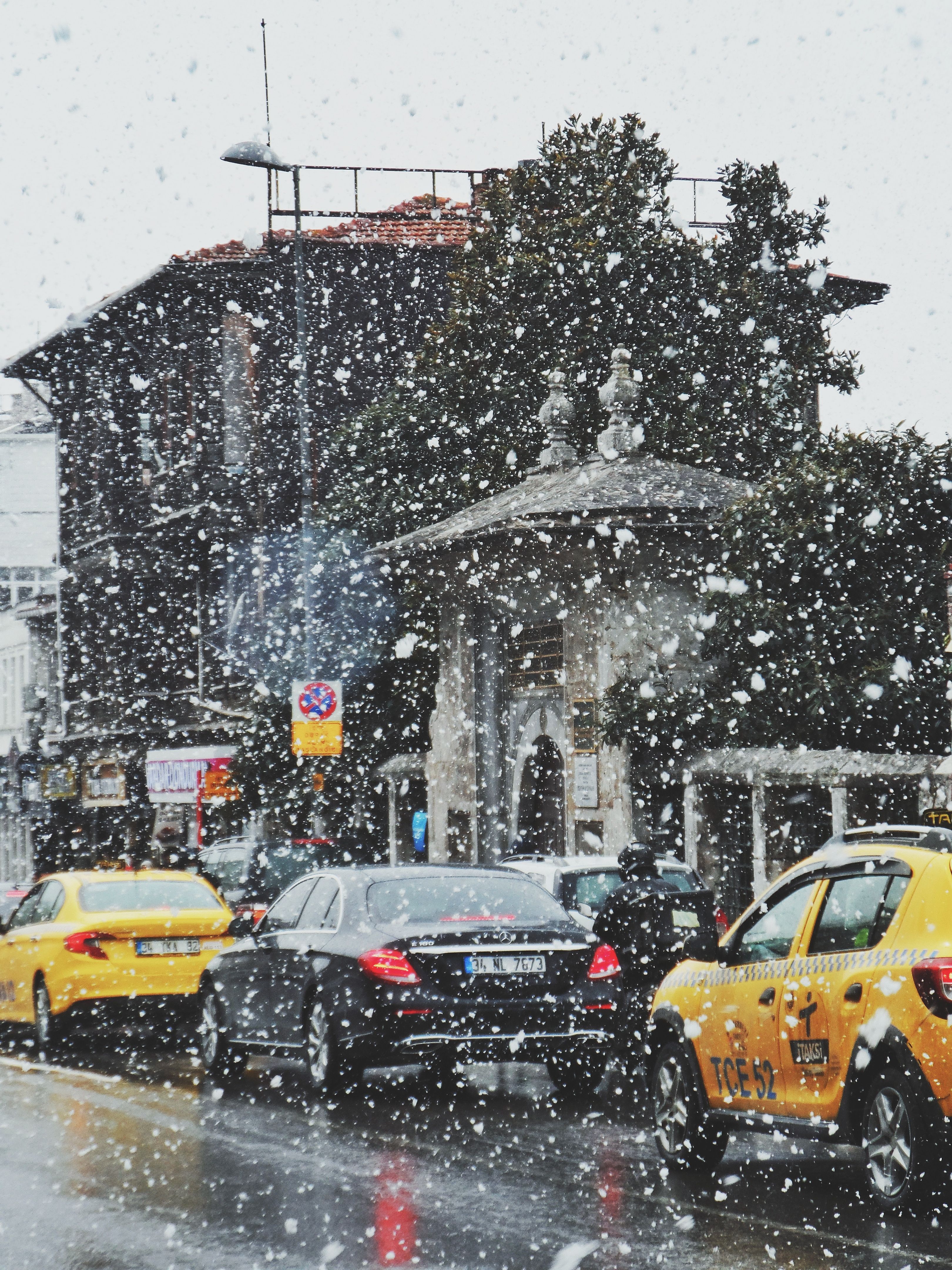 Winter Snowfall on Busy City Street with Cars · Free Stock Photo