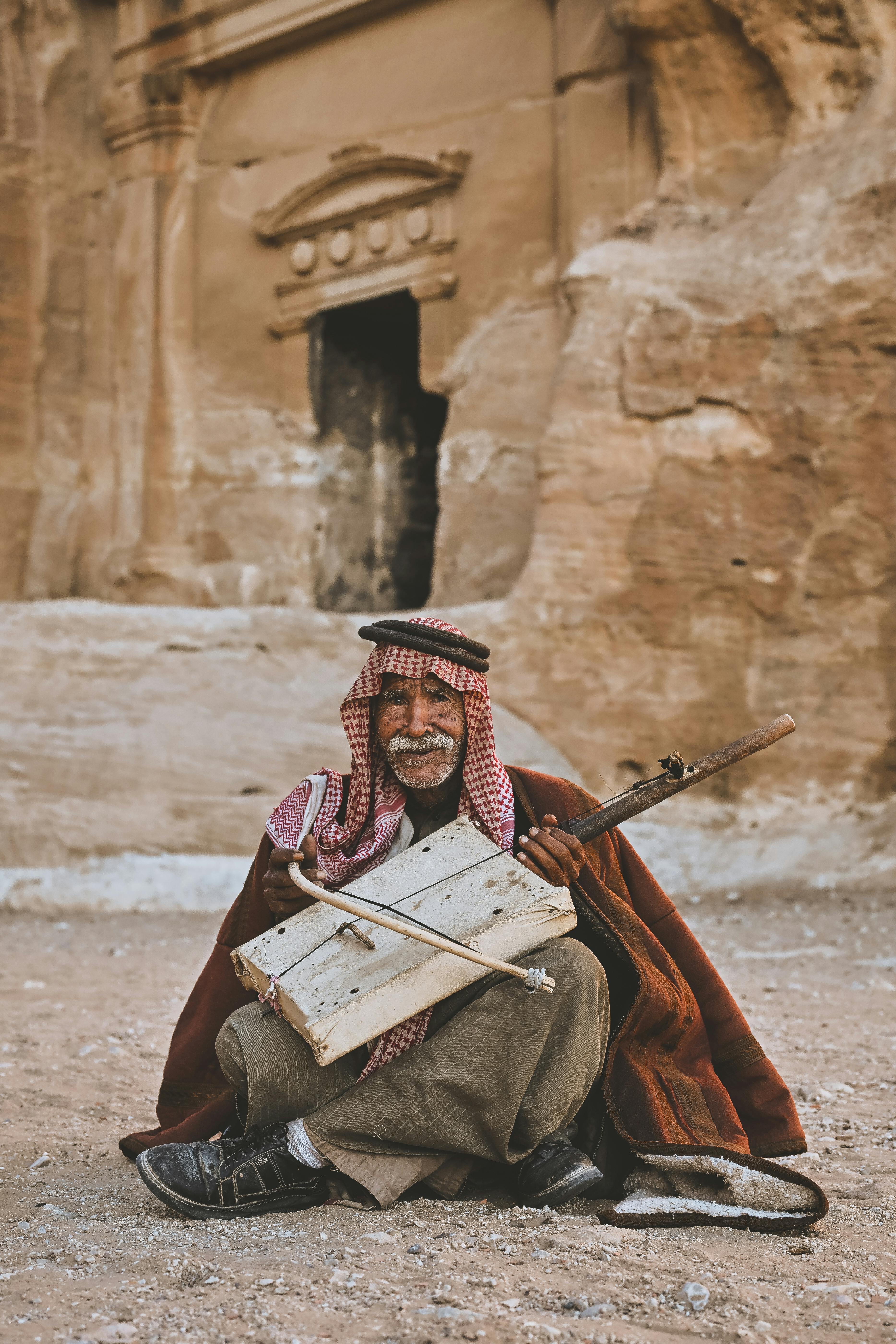 Elderly Man Playing Traditional Rababah in Petra · Free Stock Photo