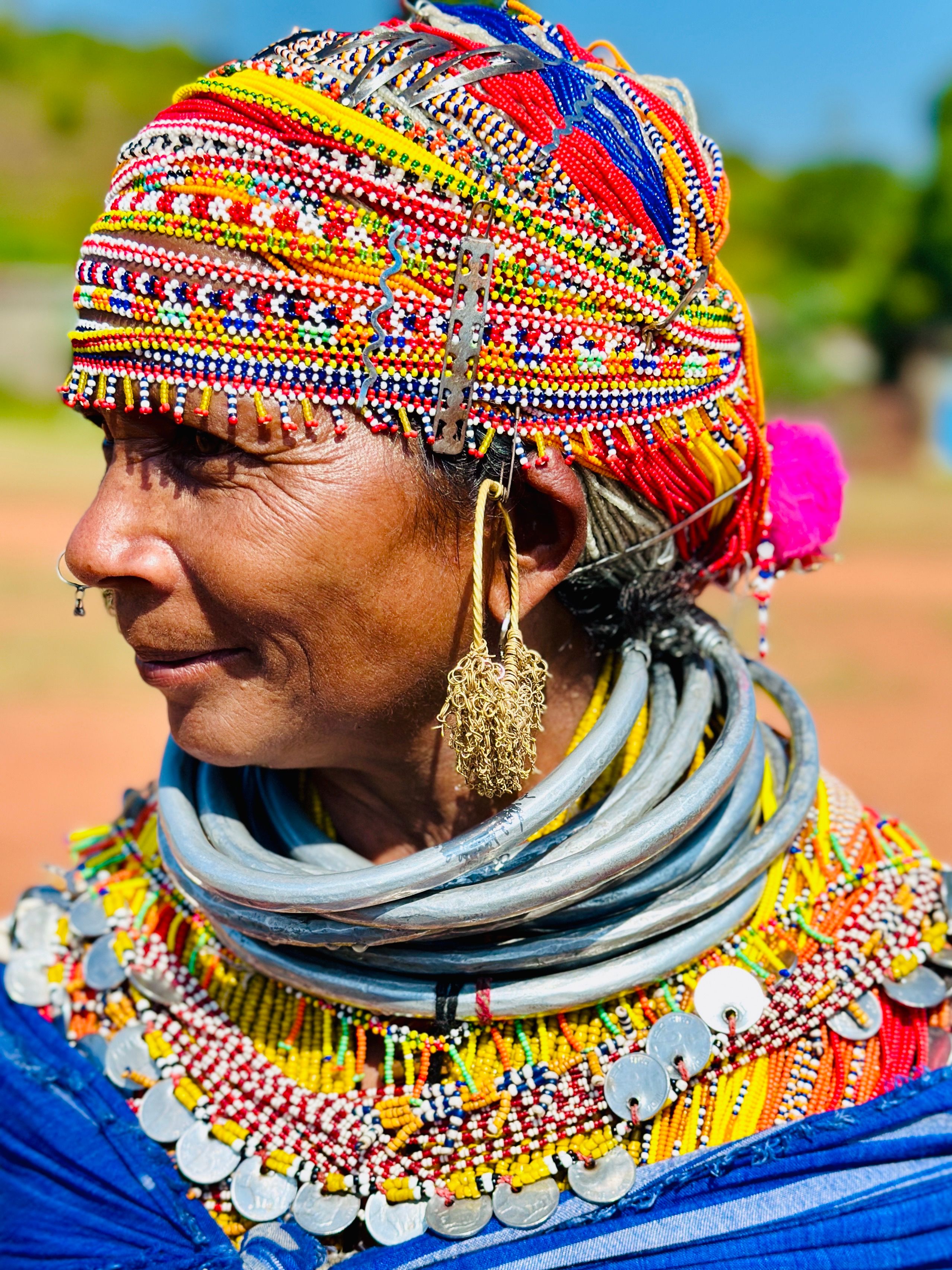 Vibrant Tribal Attire and Jewelry Portrait · Free Stock Photo