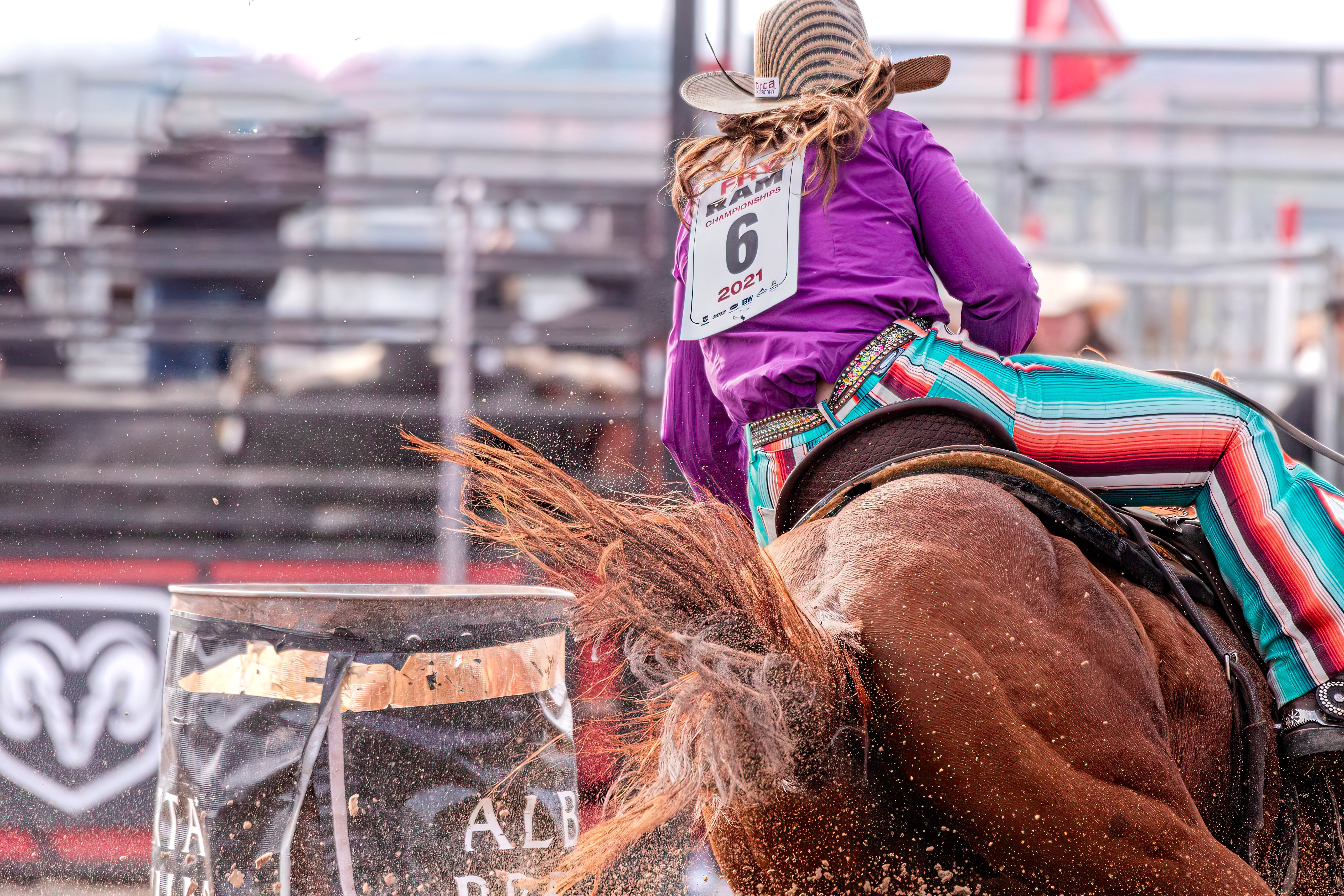 Dynamic Barrel Racing at a Rodeo Event · Free Stock Photo