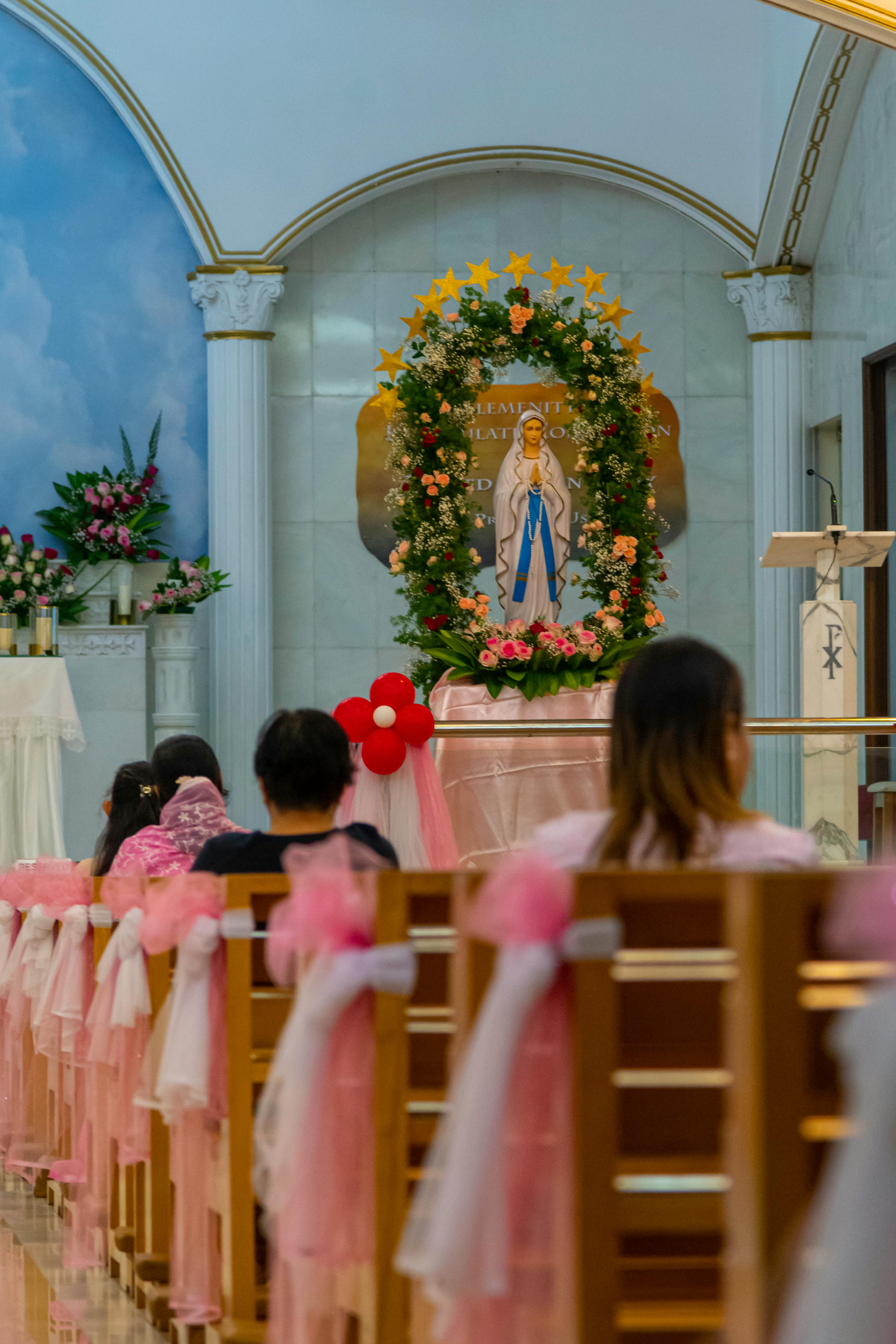 Catholic Church Ceremony with Floral Decorations · Free Stock Photo