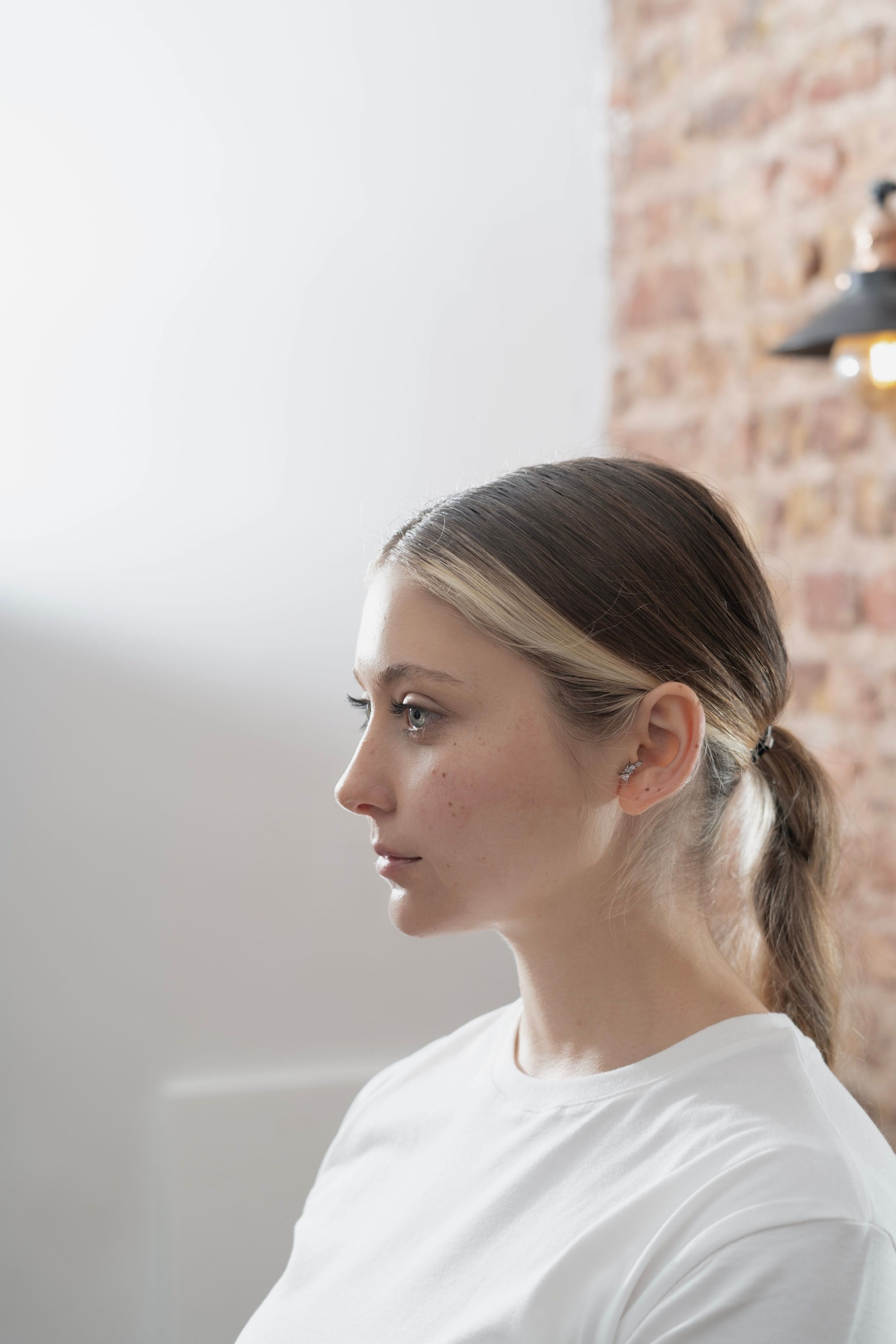 Side Profile of Woman Indoors with Soft Light · Free Stock Photo