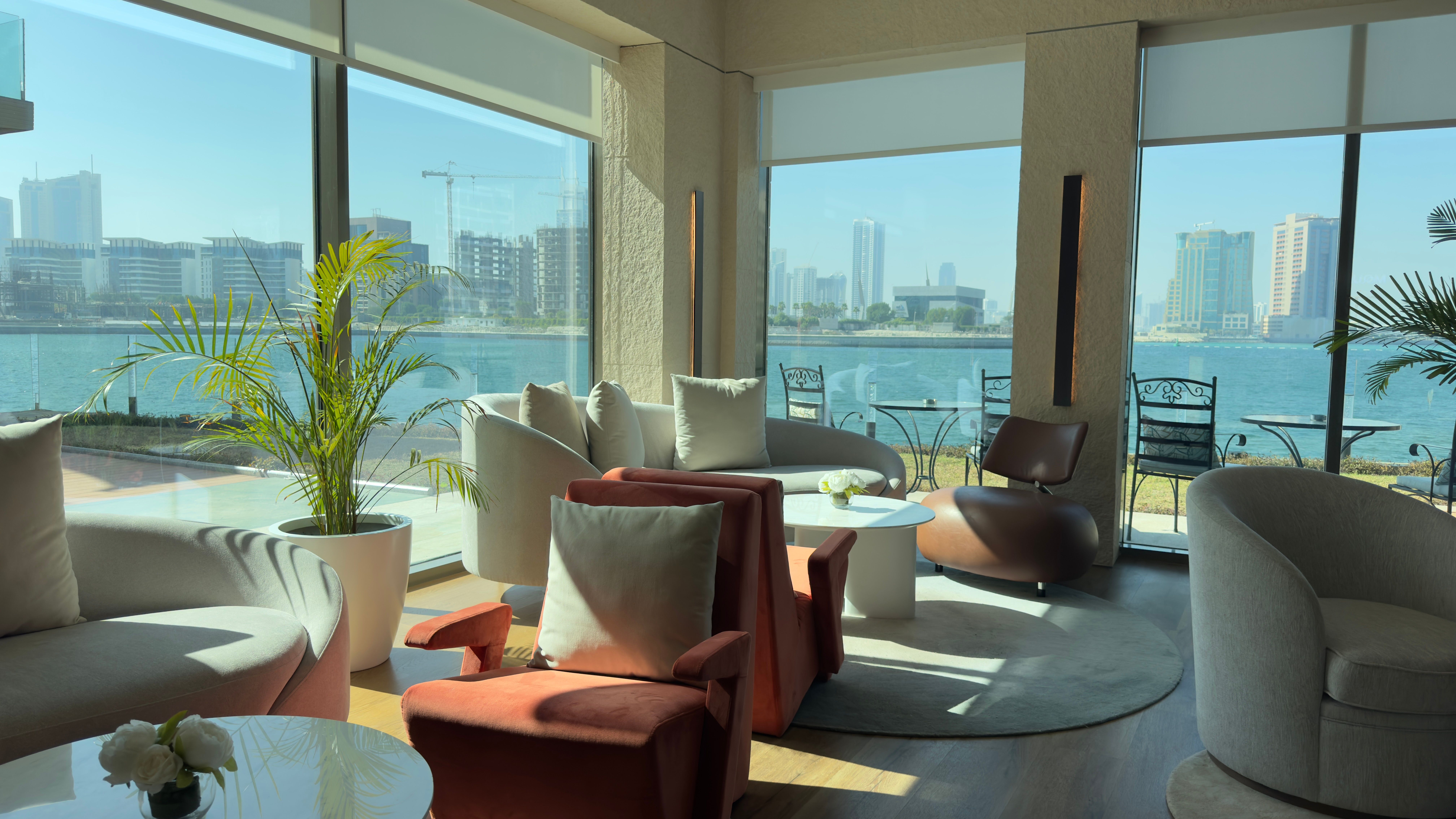 Modern Waterfront Lounge with City View · Free Stock Photo