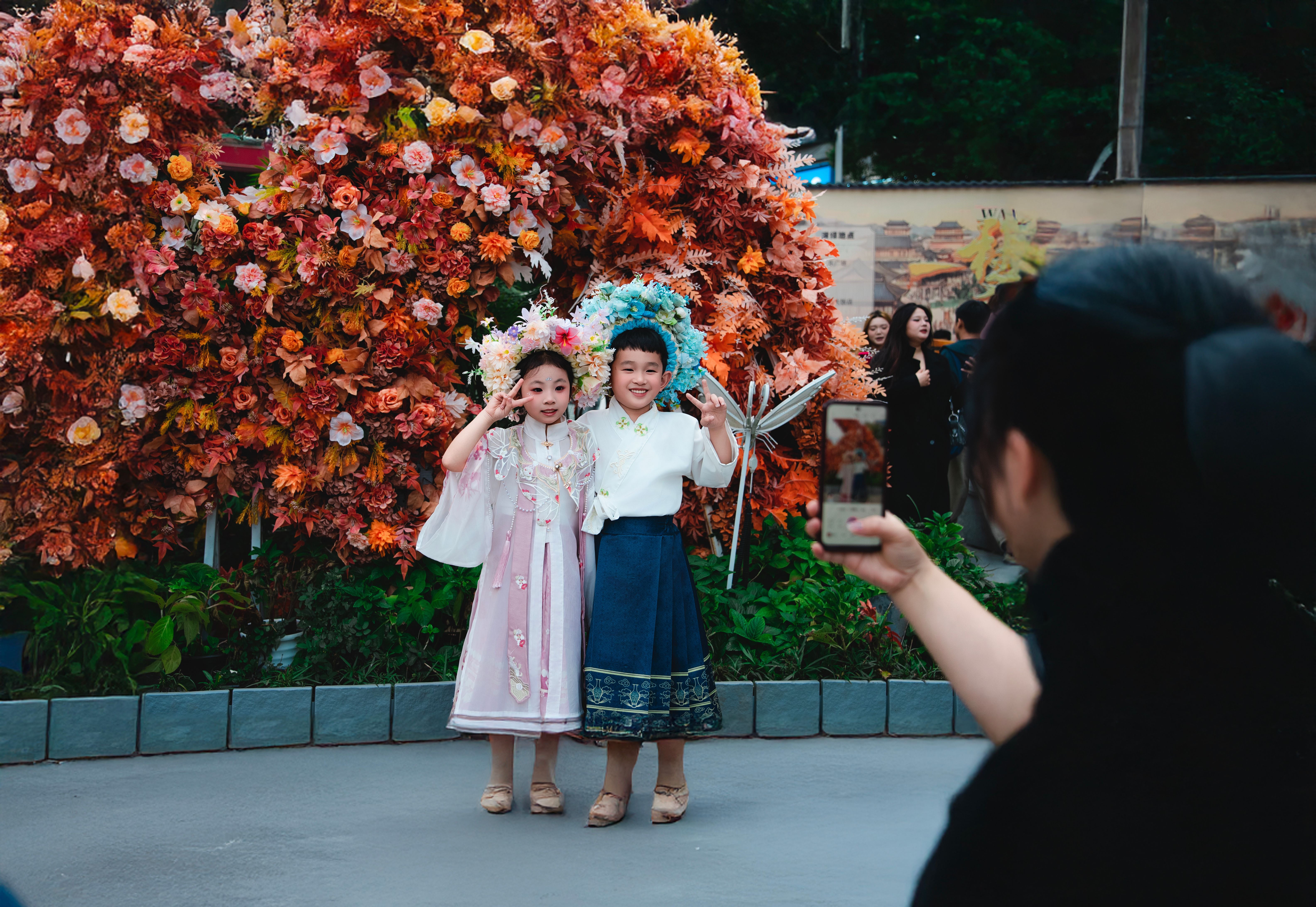 Children in Traditional Costume Pose for Photo · Free Stock Photo