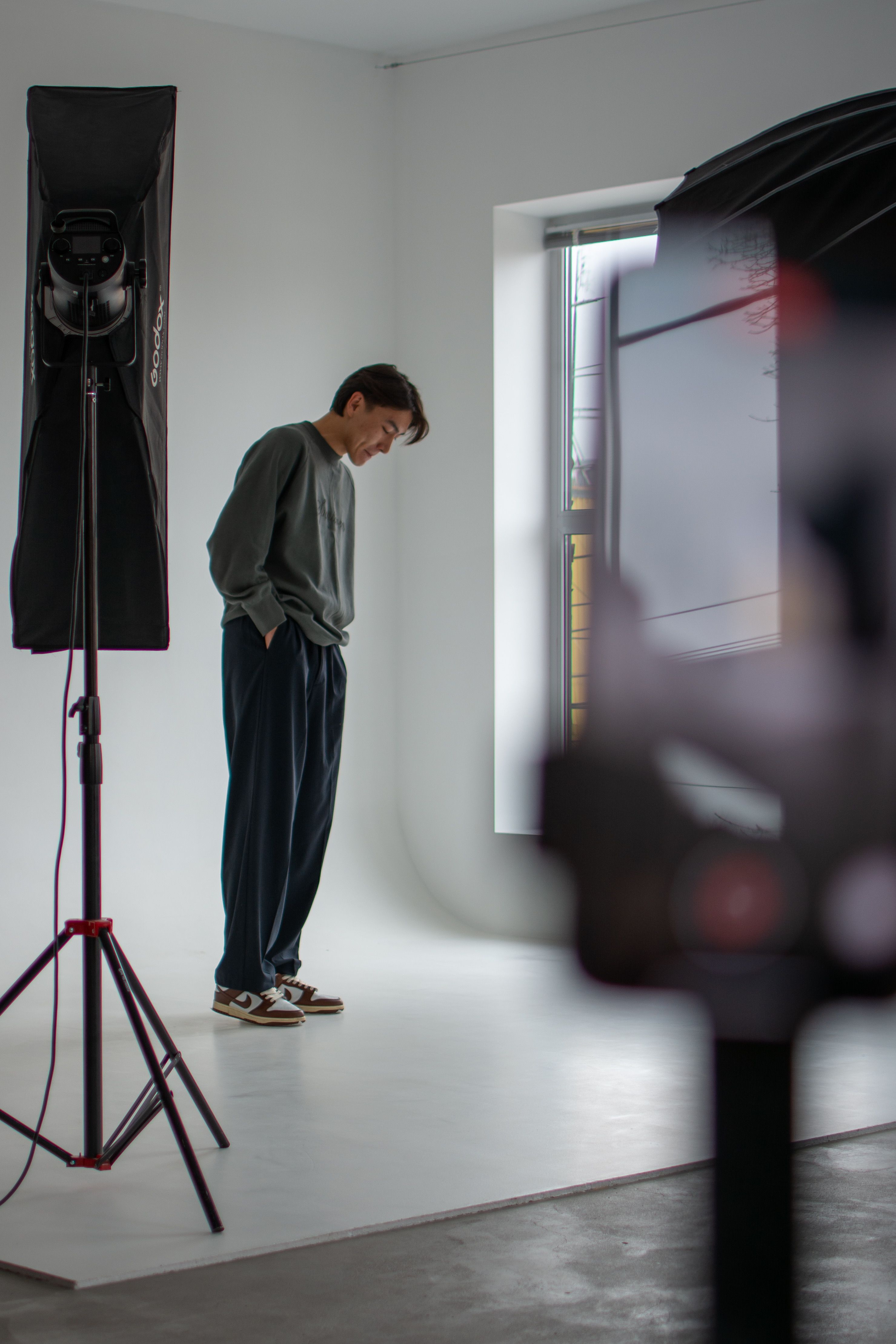 Man in Photography Studio with Lighting Equipment · Free Stock Photo