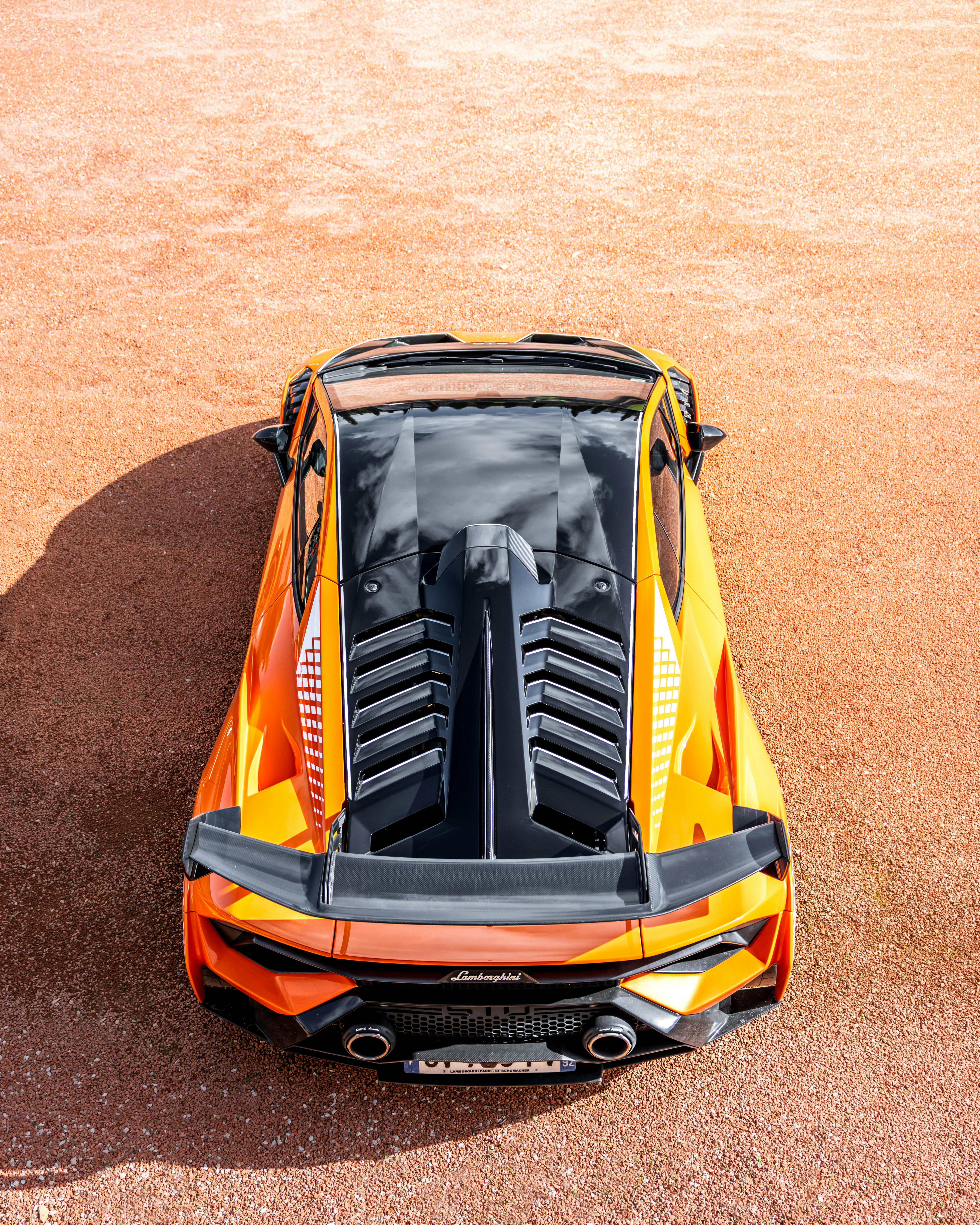 Aerial View of Orange Lamborghini Huracan Supercar · Free Stock Photo