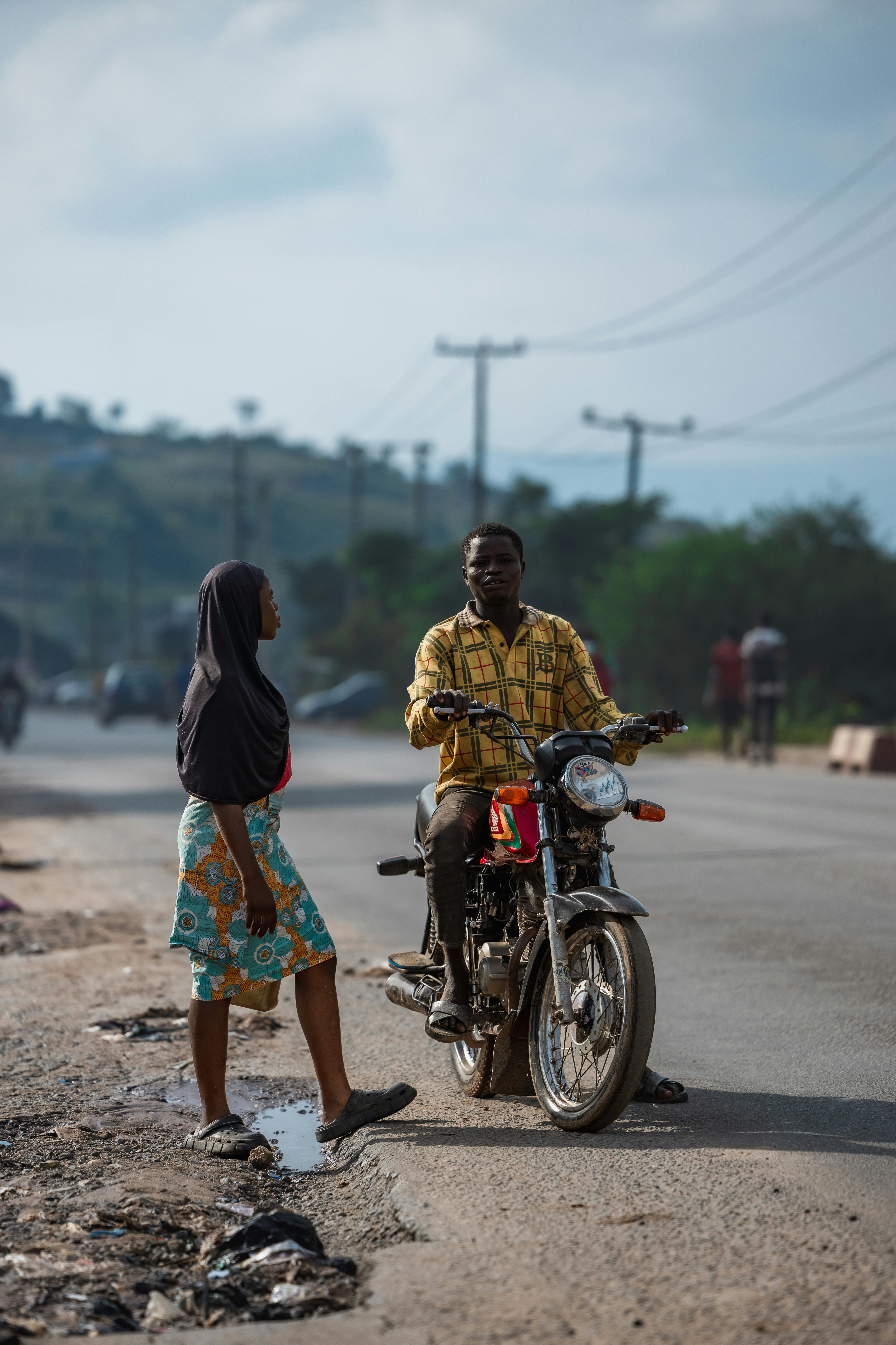 Street Interaction in Abuja with Motorcycle · Free Stock Photo