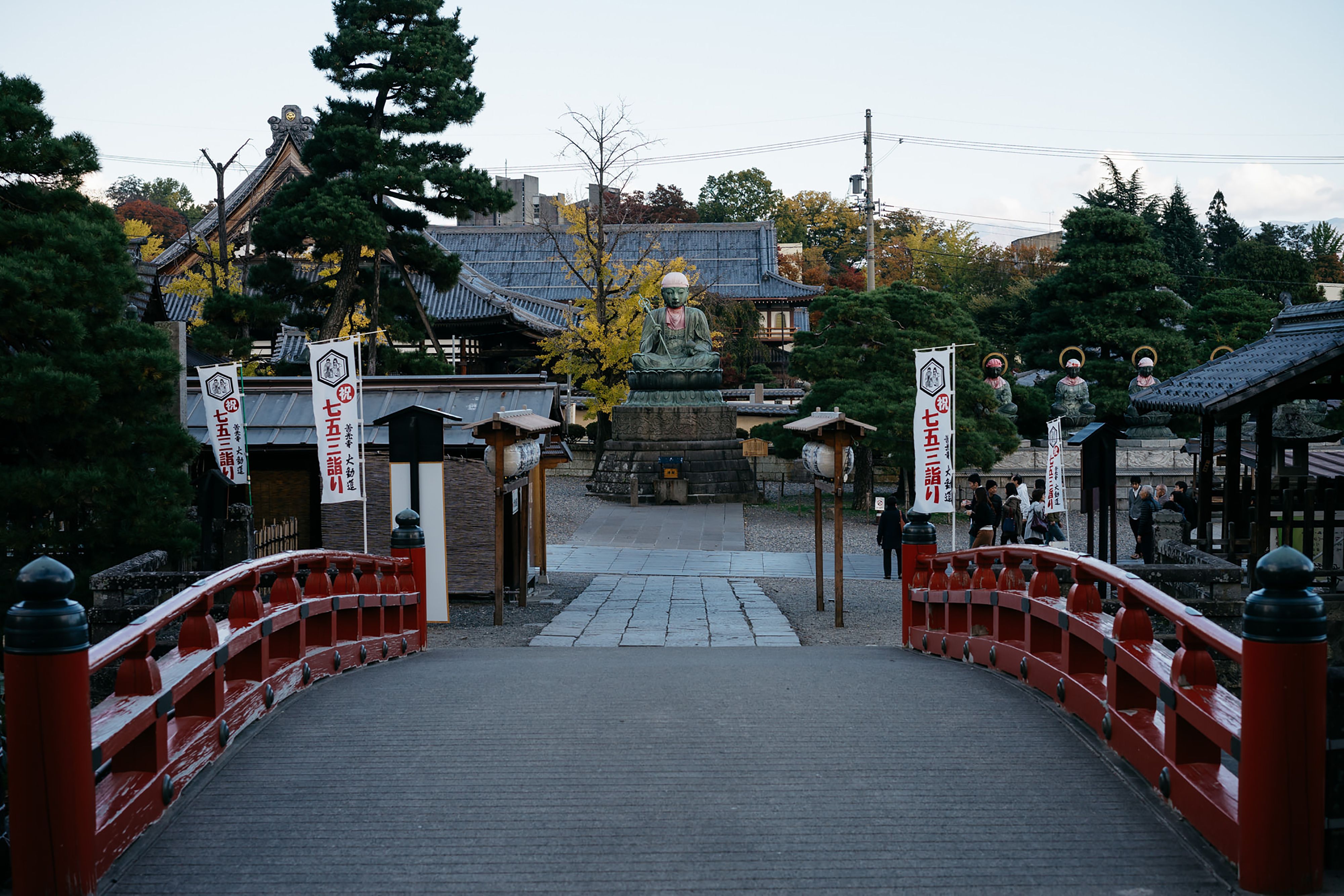 Serene View of Japanese Temple and Bridge in Fall · Free Stock Photo