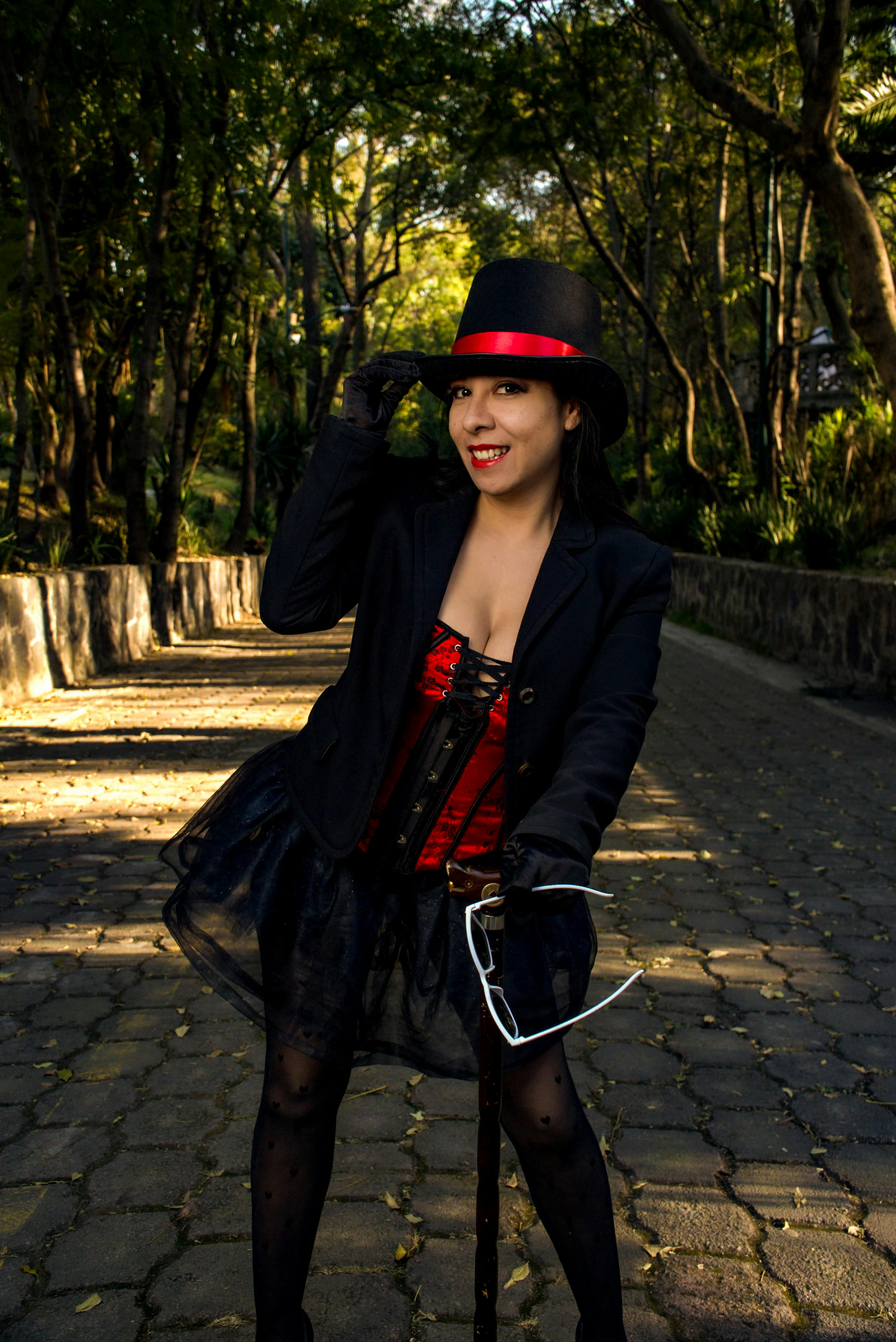 Stylish Woman in Top Hat Posing Outdoors · Free Stock Photo