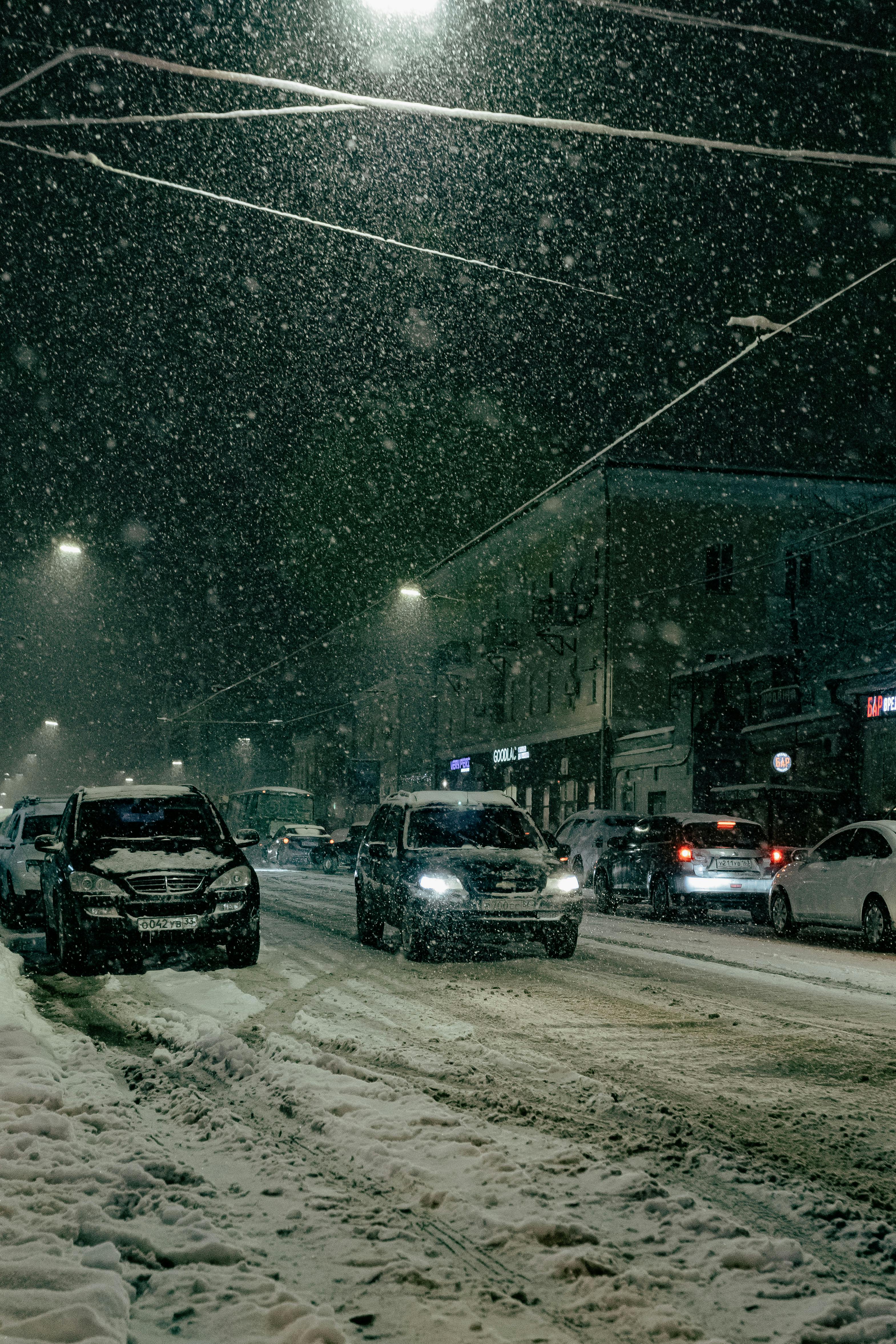 Snowy Night City Street with Cars · Free Stock Photo