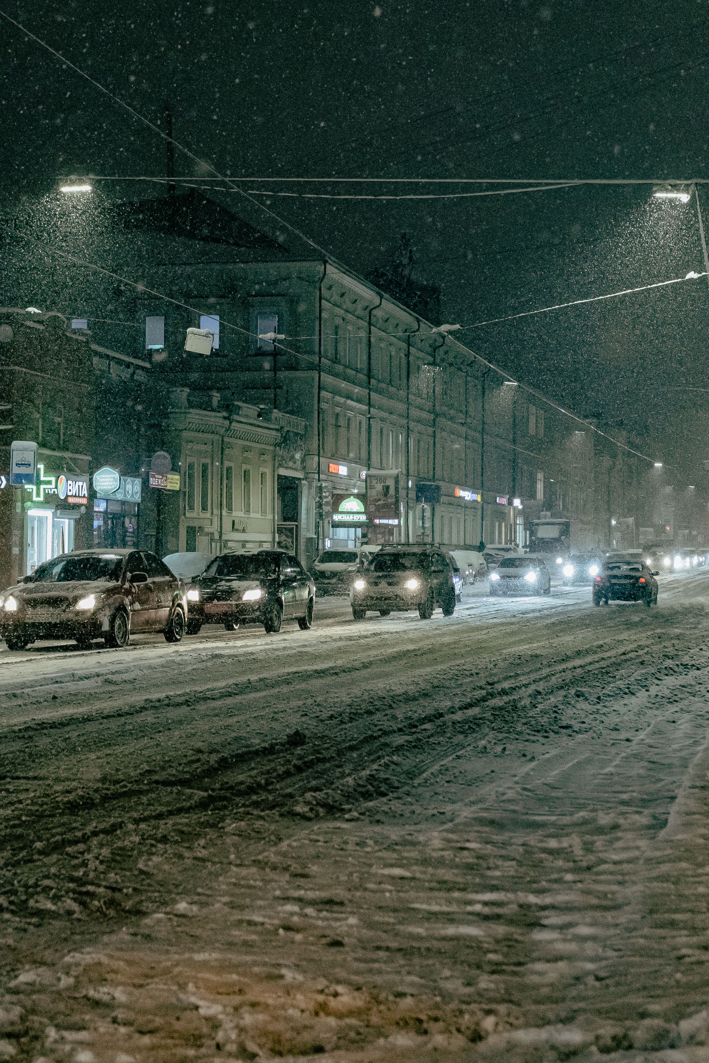 Snowy Night City Street with Traffic Lights · Free Stock Photo