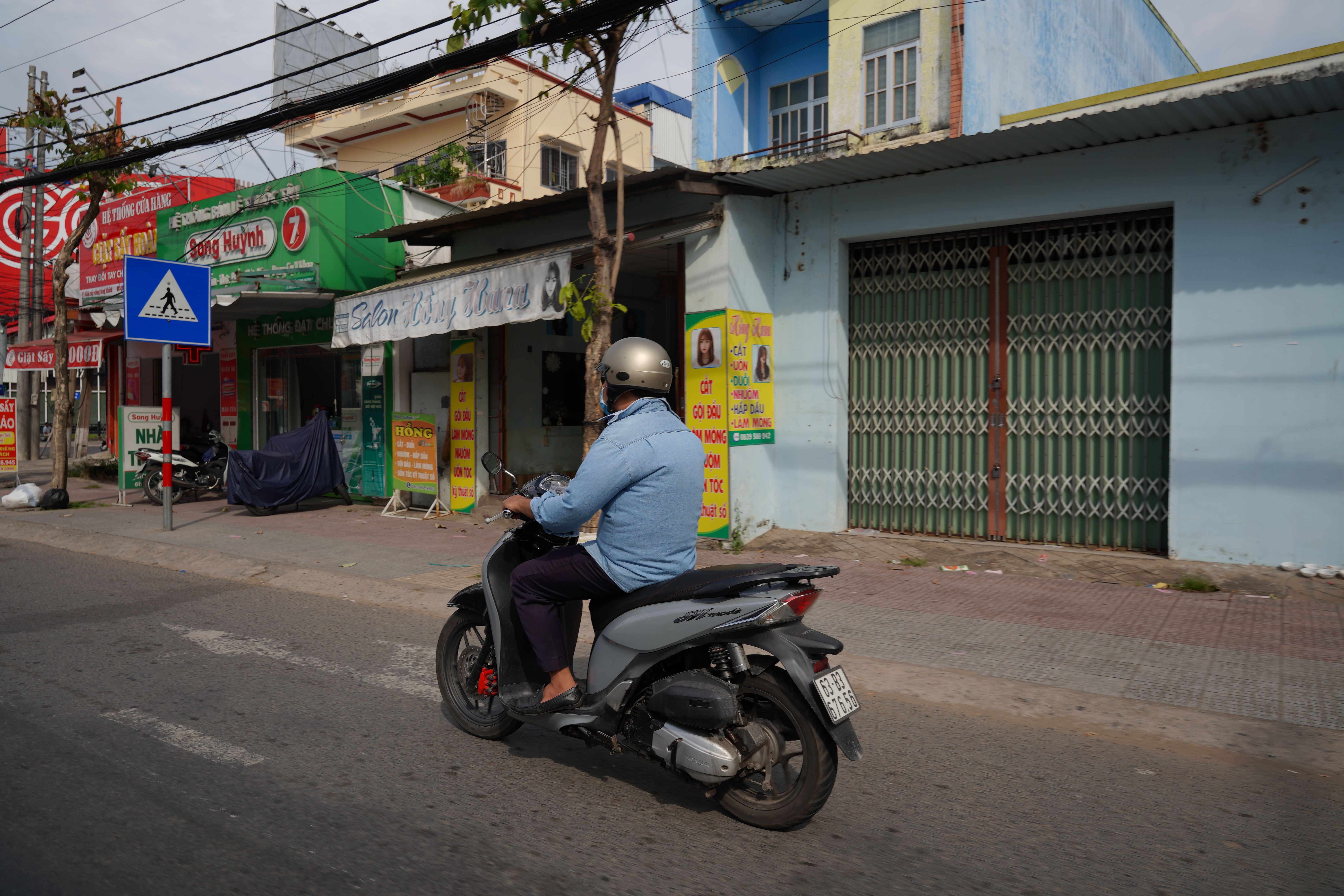 Urban Street Scene with Motorcyclist in Asia · Free Stock Photo
