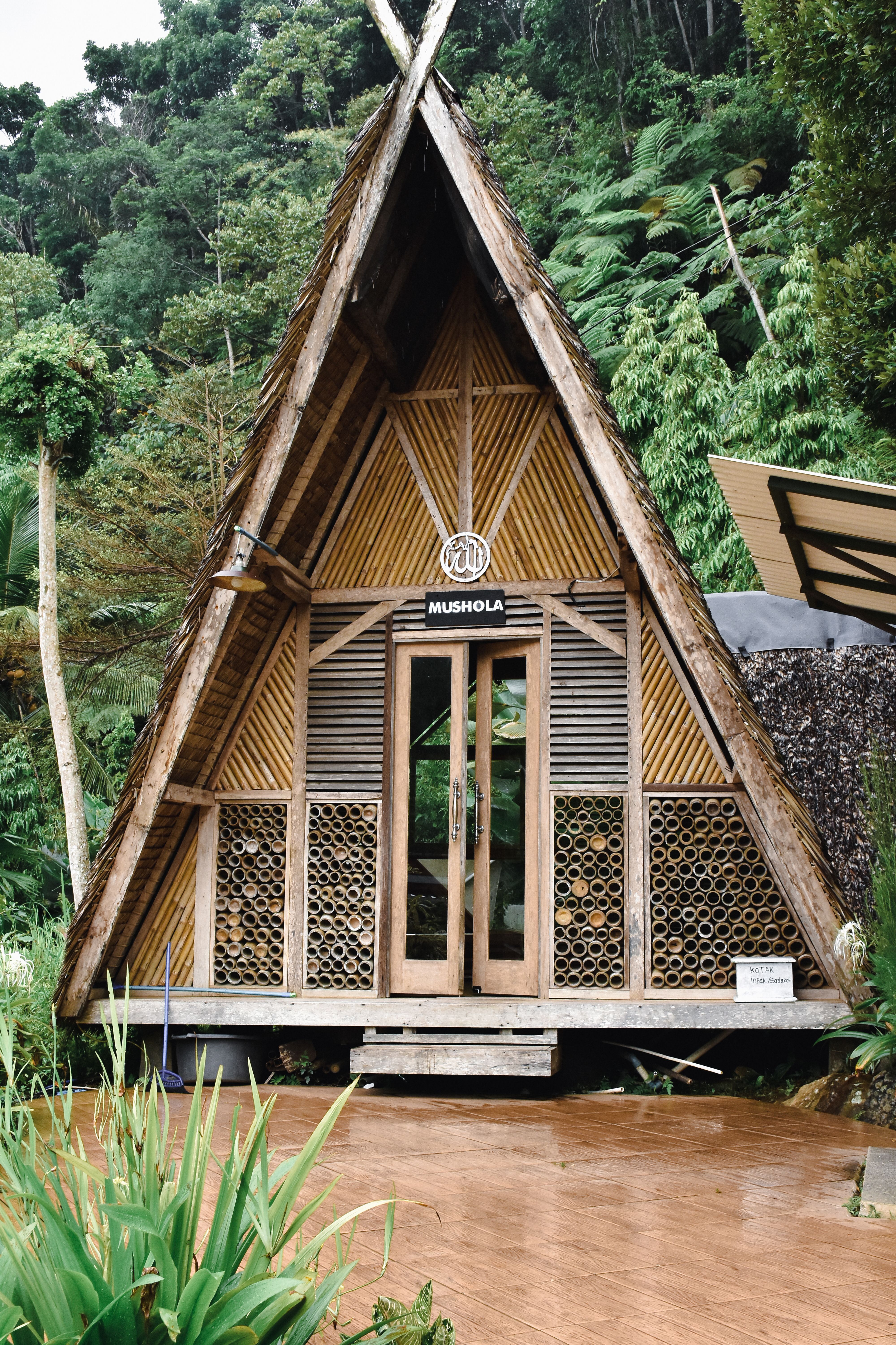 Unique A-Frame Wooden Cabin in Lush Forest · Free Stock Photo