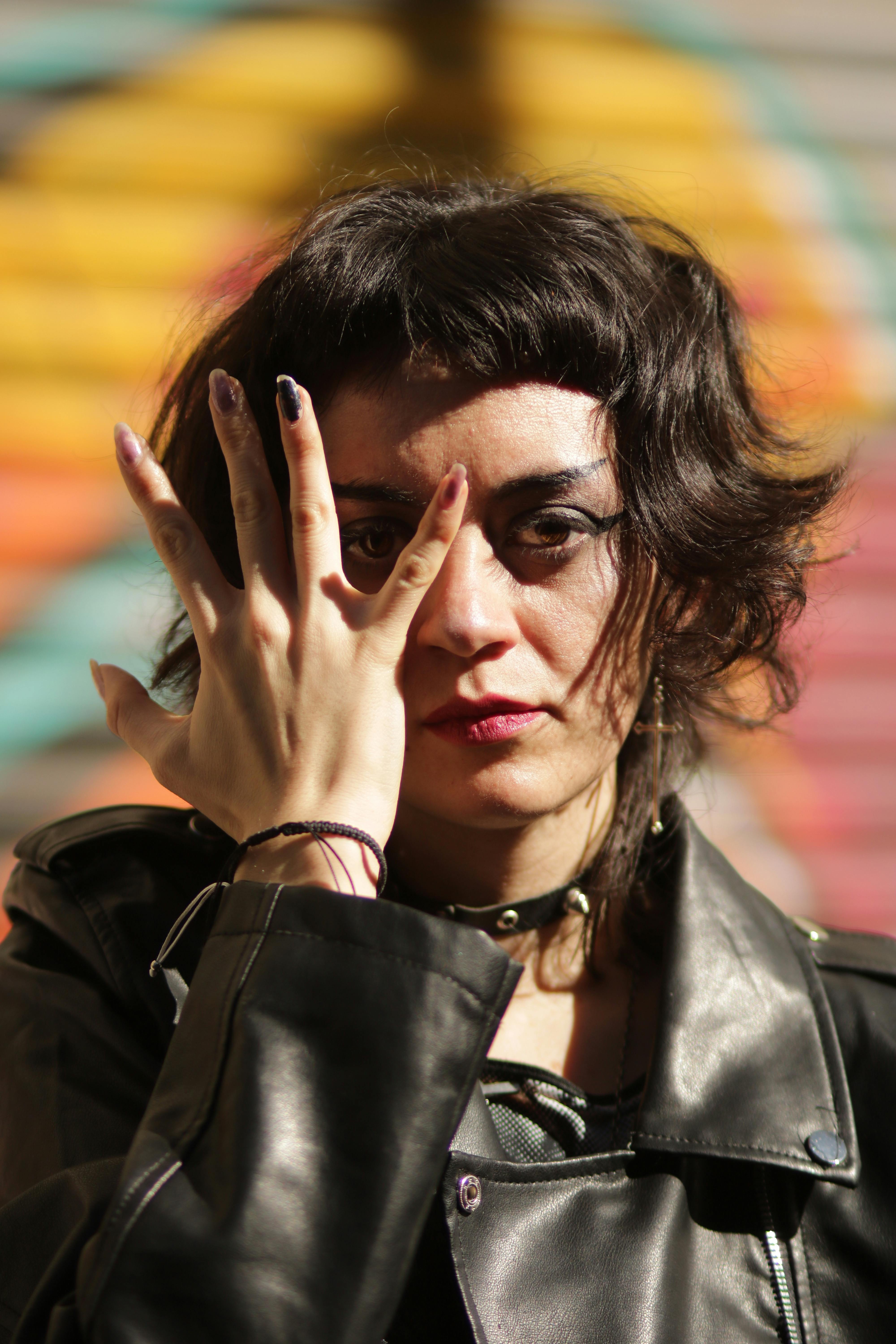 Edgy Portrait with Bold Hand Gesture · Free Stock Photo