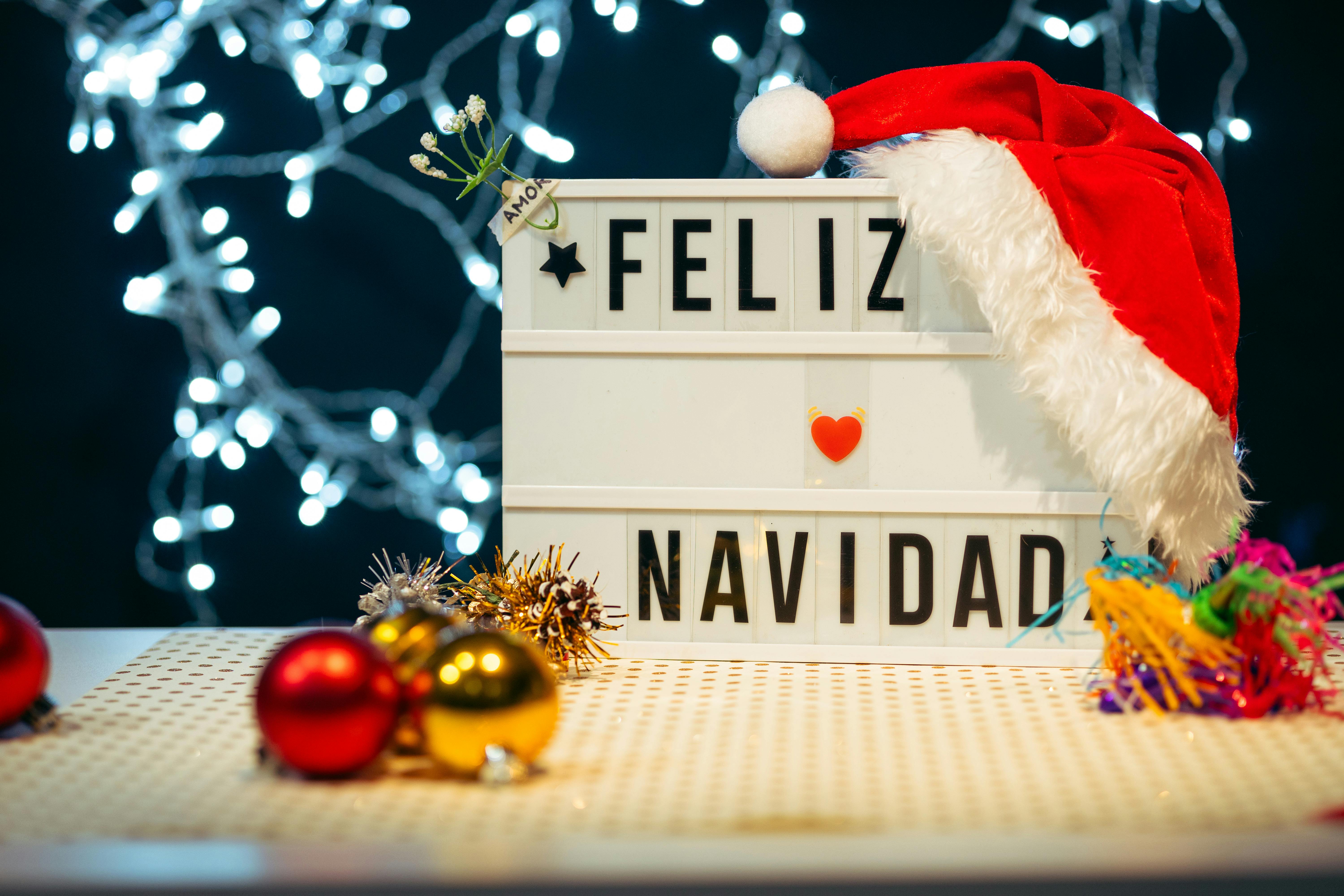 Festive Feliz Navidad Sign with Decorations · Free Stock Photo